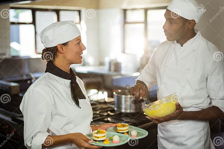 Chefs Talking To Each Other while Working in Kitchen Stock Image ...