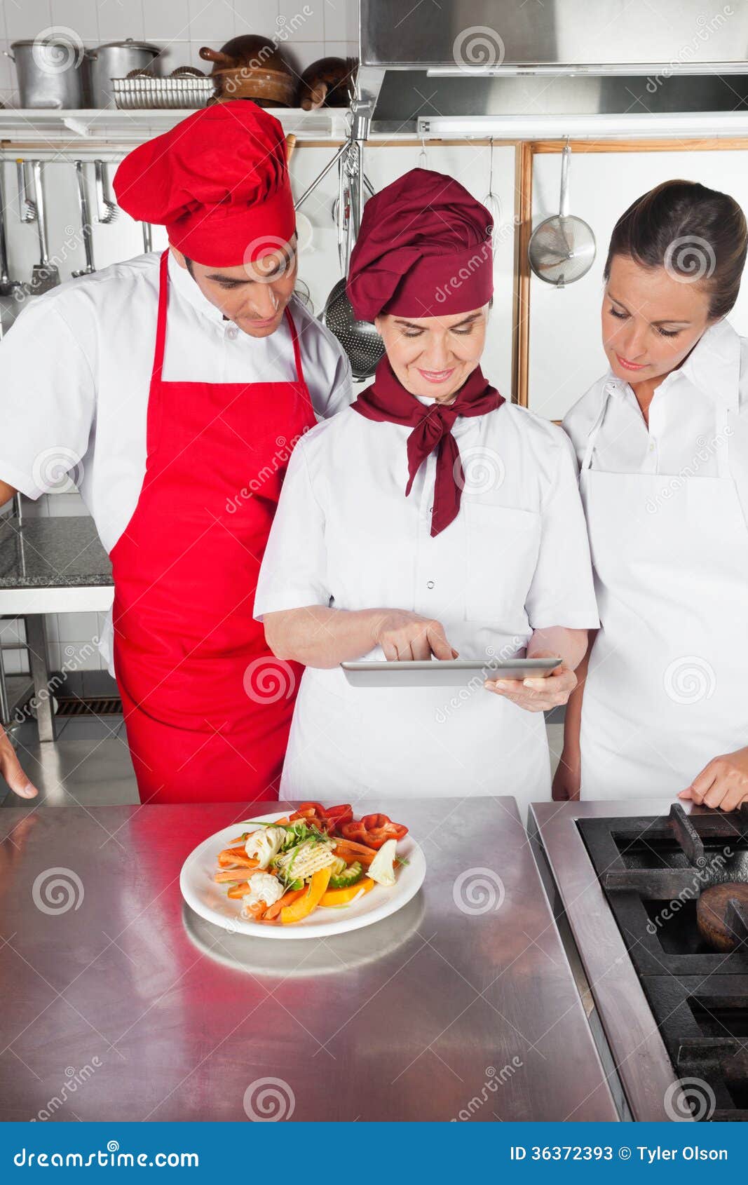 Chefs Using Digital Tablet in Kitchen Stock Image - Image of industry ...
