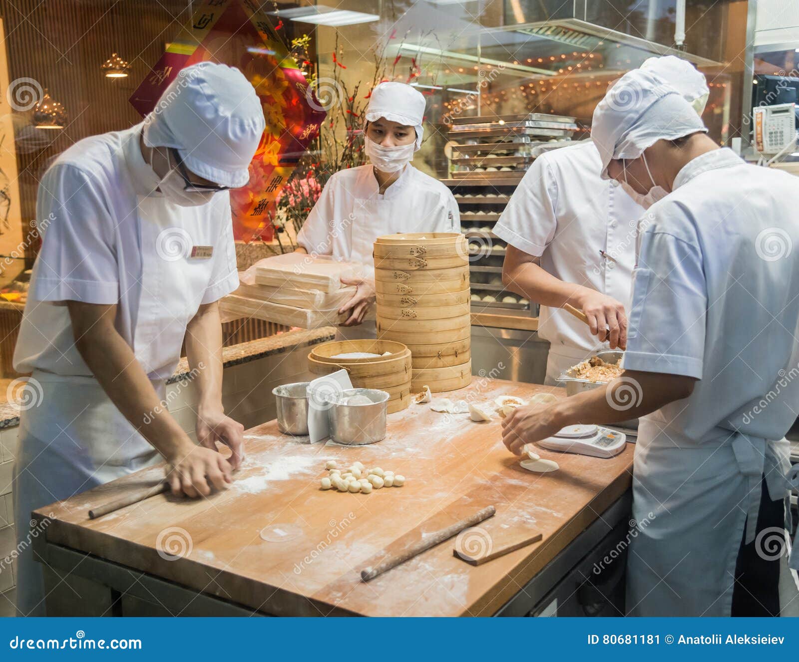 Chefs In White Uniforms Cooked Dish Of Dough In A Clean Kitchen ...