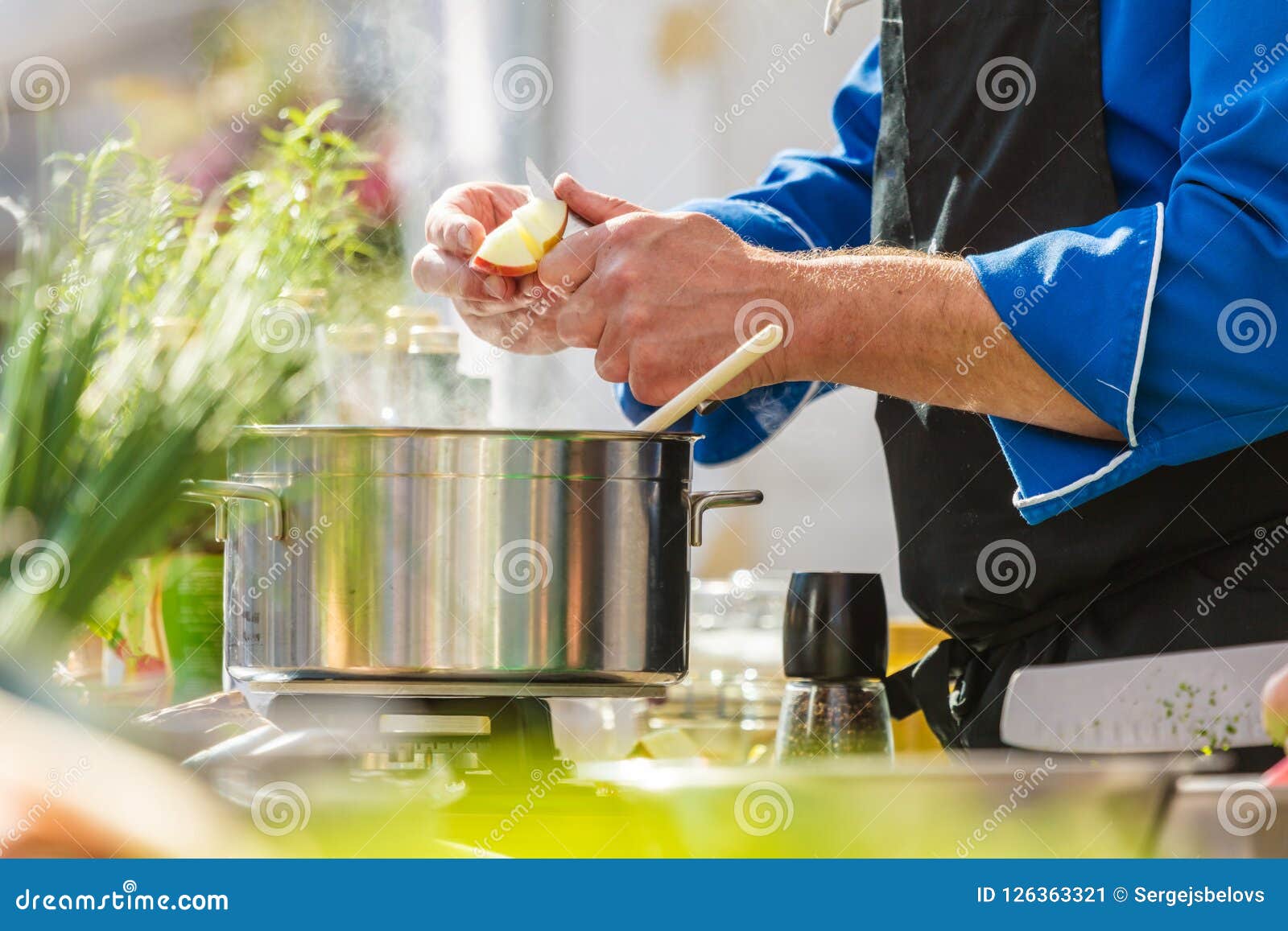 Chefs at Work in a Restaurant Kitchen Making Delicious Food Stock Image ...