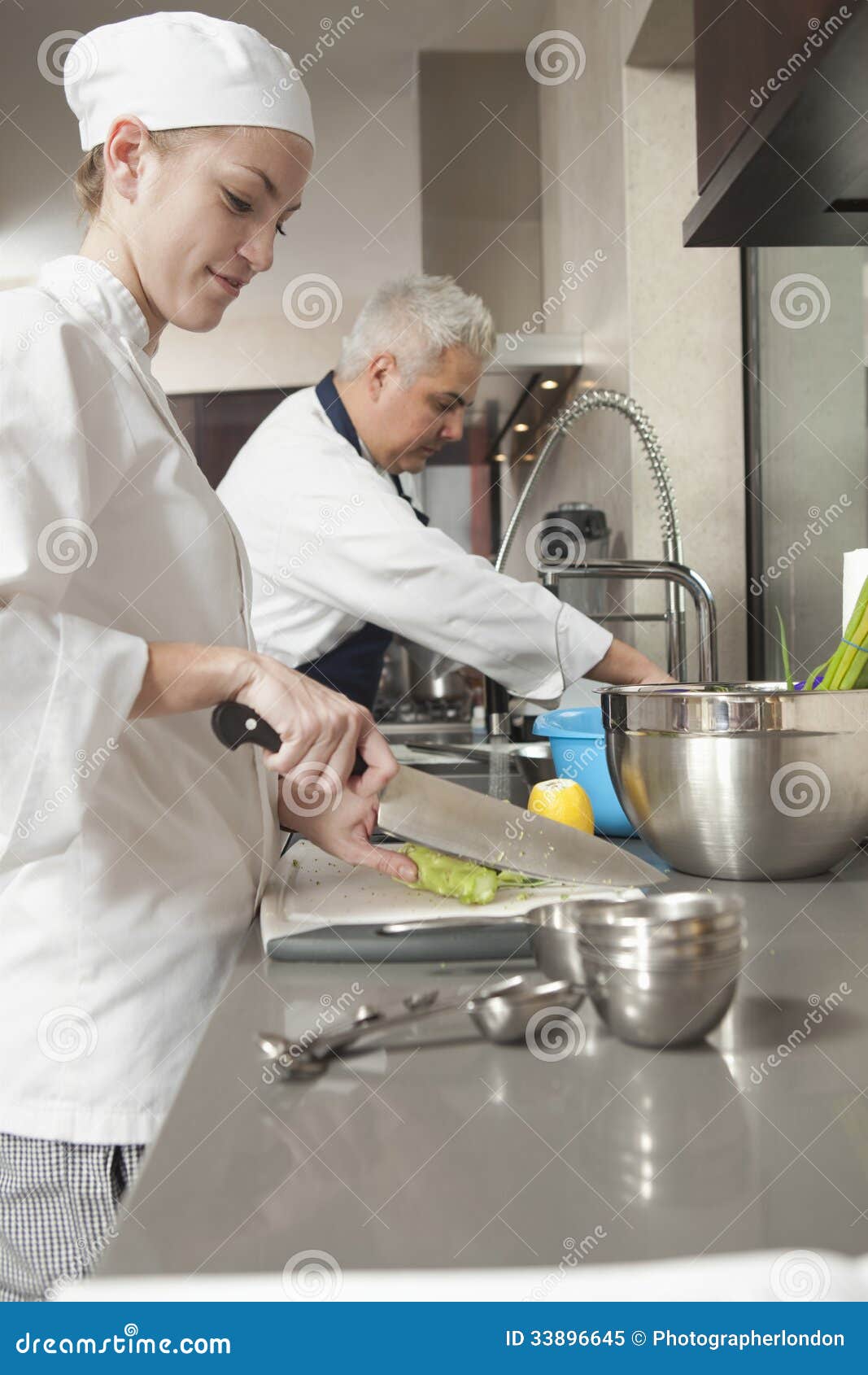 Chefs Working in Commercial Kitchen Stock Image - Image of counter ...