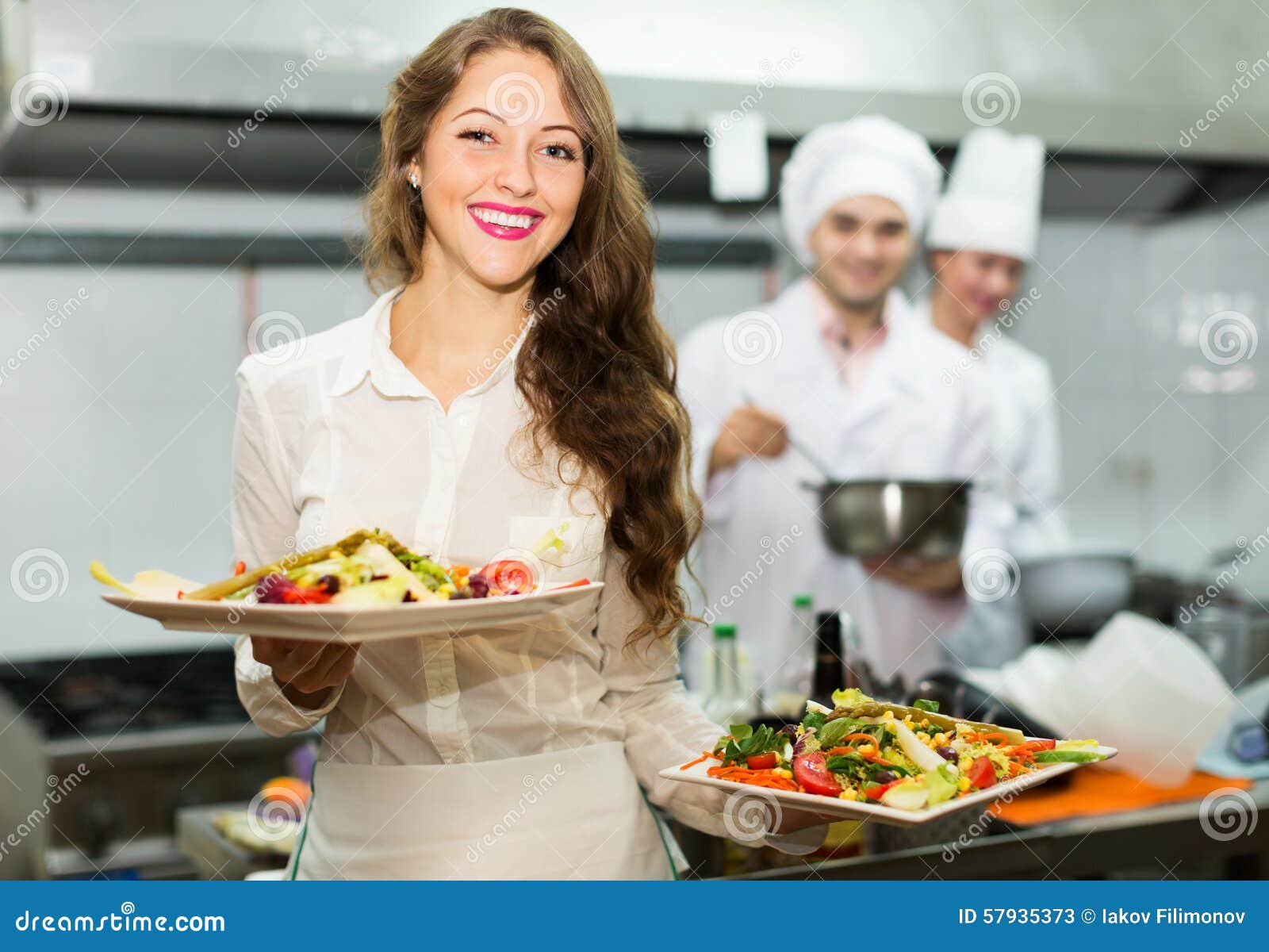 Chefs and young waiter stock image. Image of colleagues - 57935373