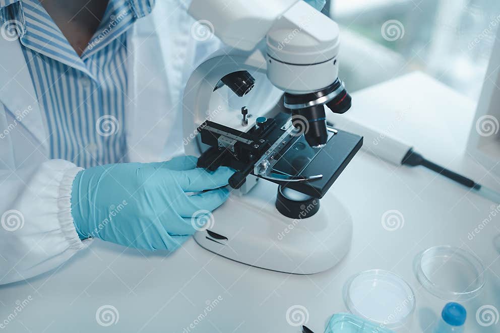 Chemist is Doing an Experiment in the Laboratory, a Scientist is Using ...