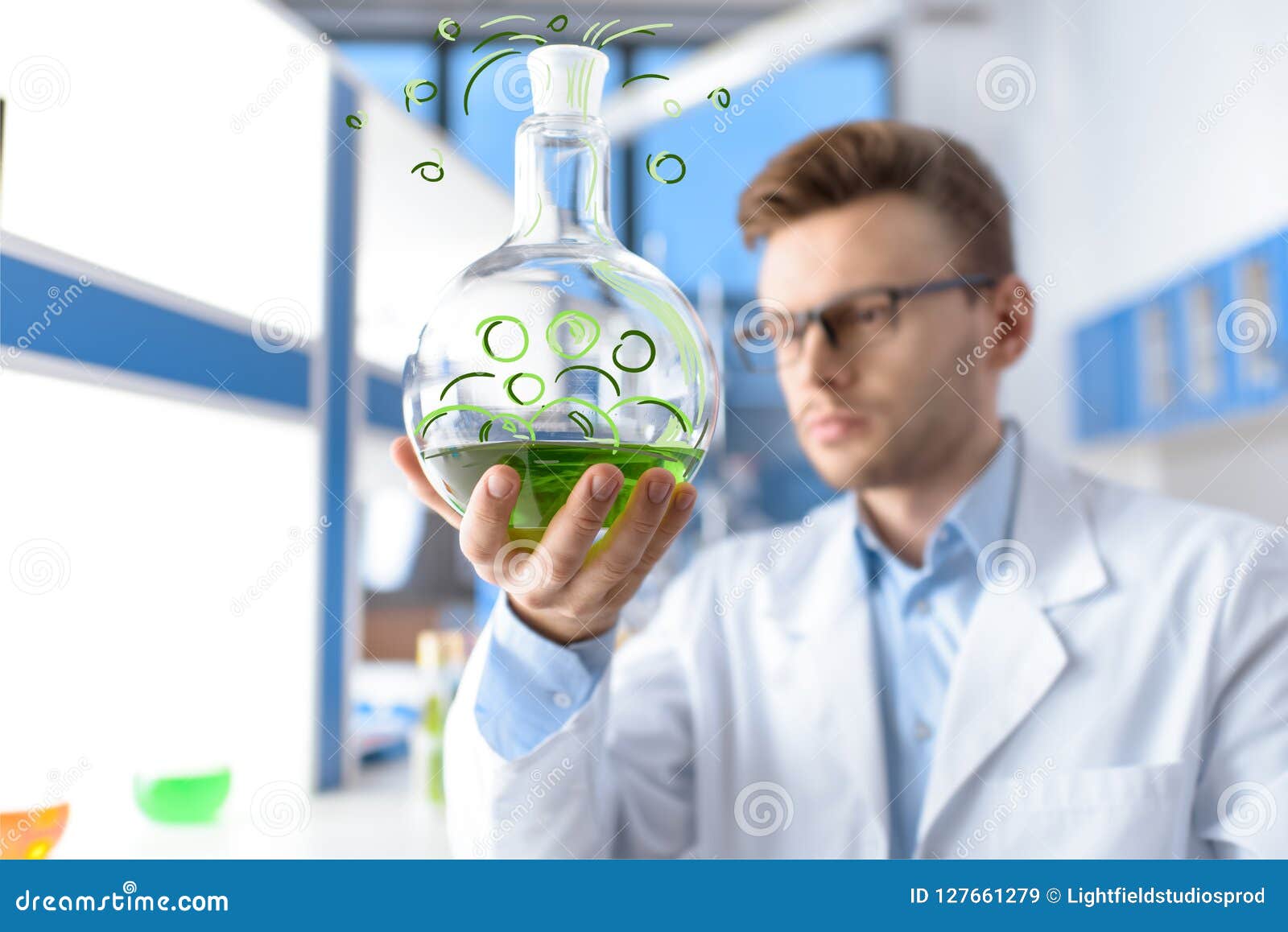 Chemist Holding A Laboratory Flask. Scientist Wearing Safety Glasees ...