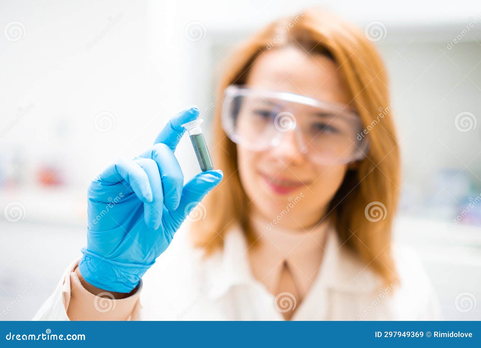 Chemist Holding a Test Tube with Blue Solution Stock Image - Image of ...