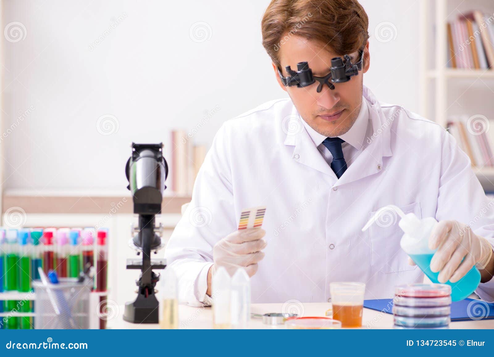 The Chemist in the Lab Checking with Ph Strips Stock Image - Image of ...