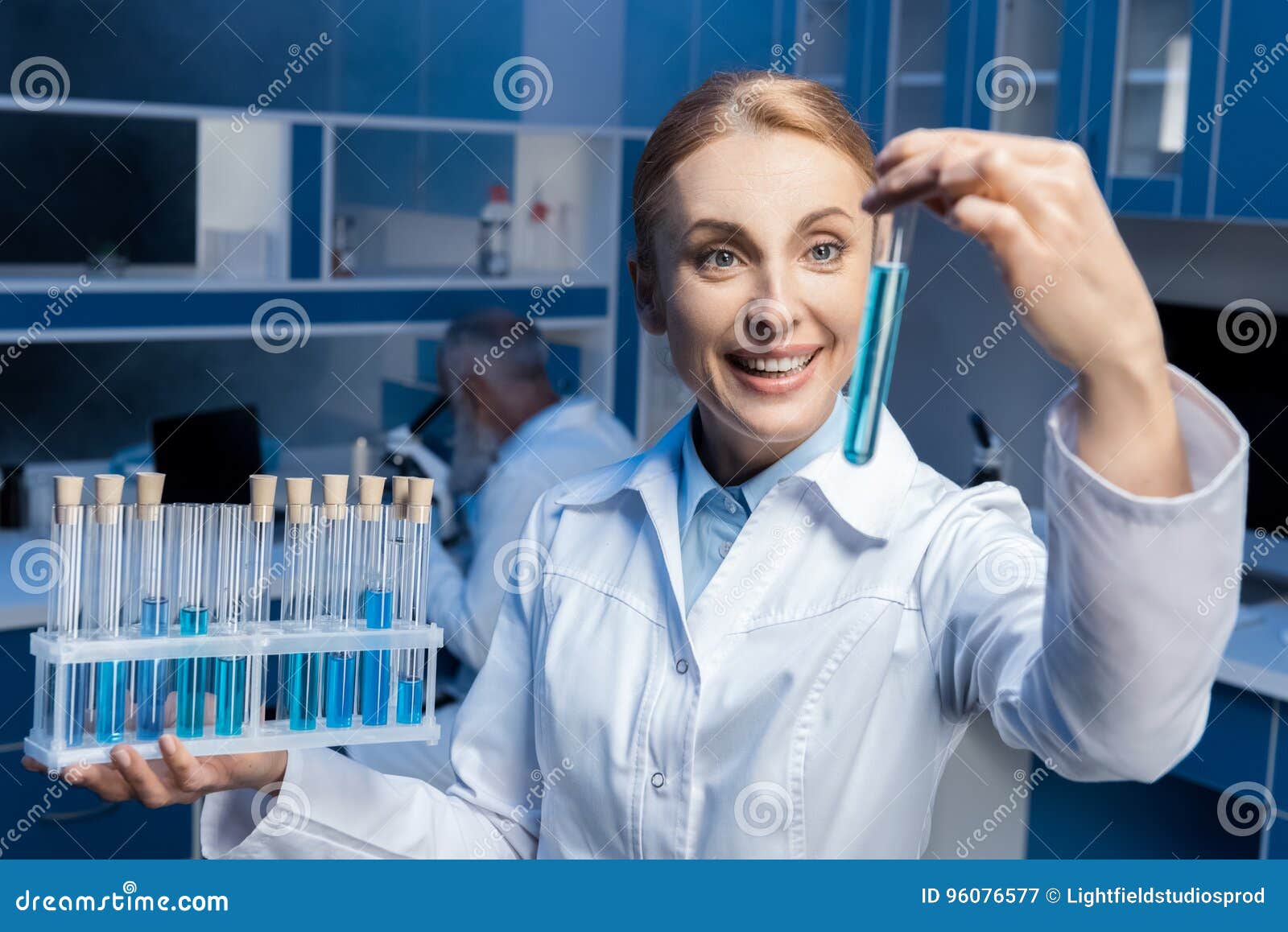 Chemist in Lab Coat Holding Tubes at Laboratory Stock Image - Image of ...