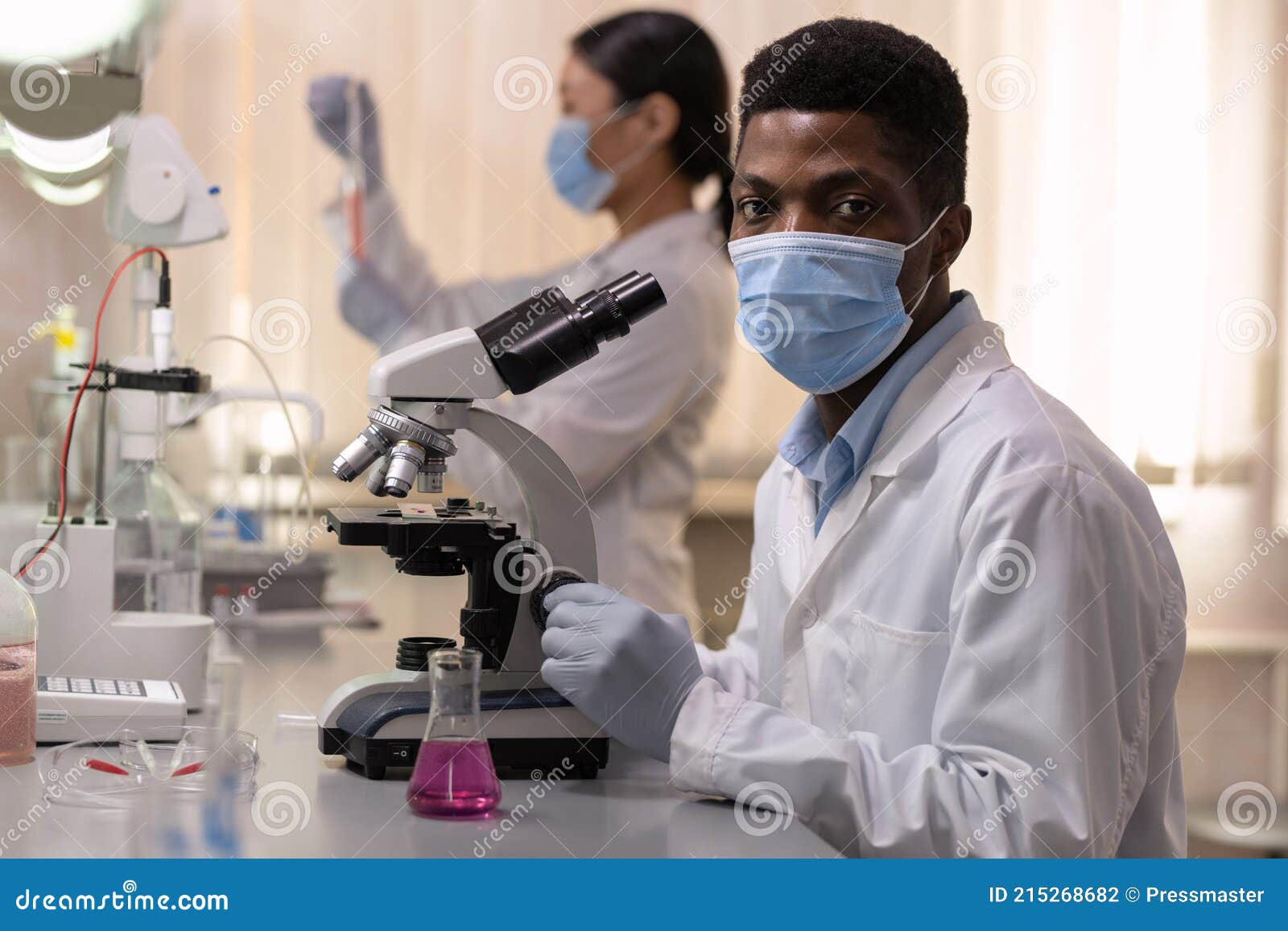 Chemist in Mask Working in the Lab Stock Photo - Image of looking ...