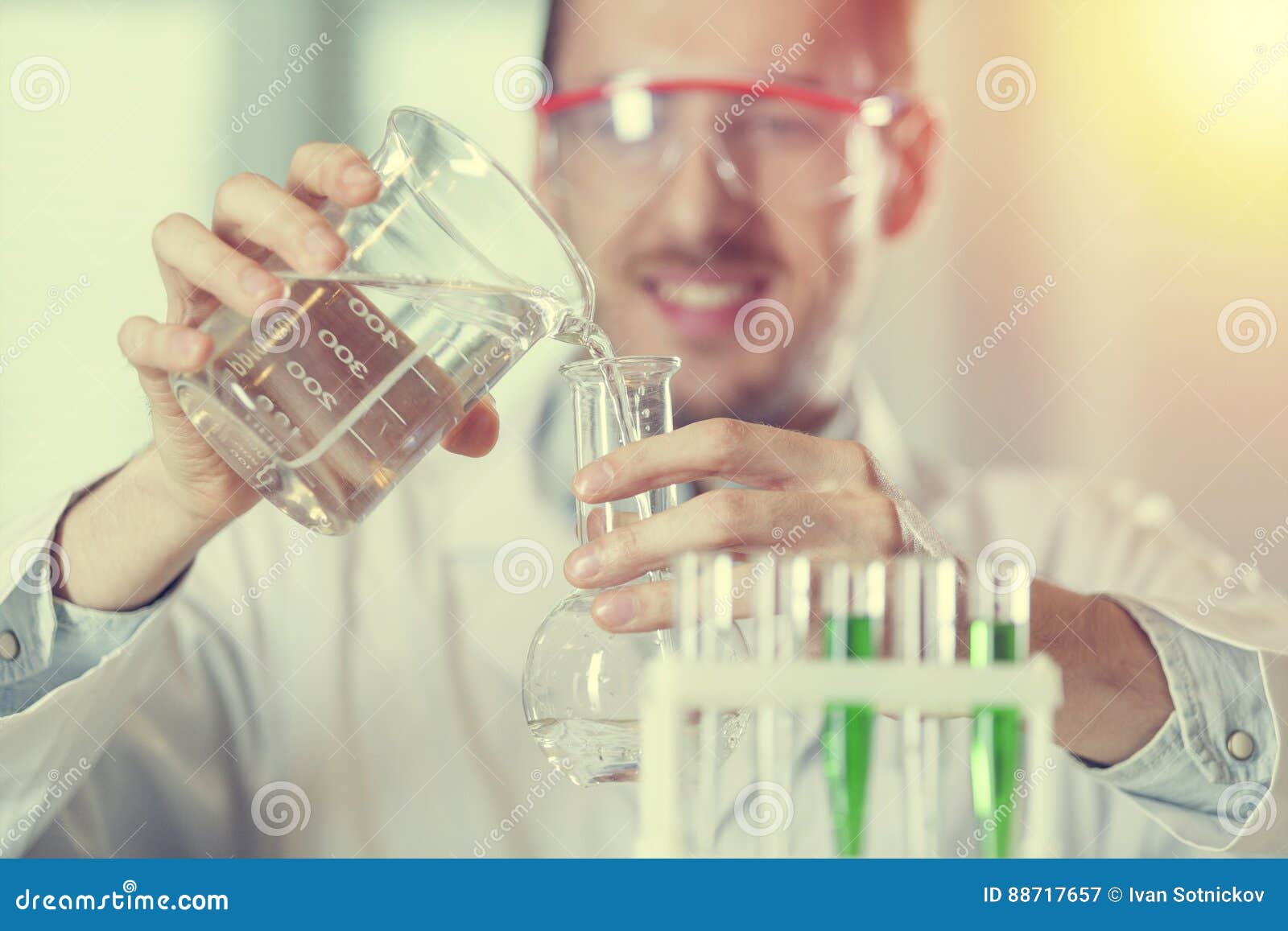 Chemist with a Measuring Beaker and Flask in Hand Stock Image - Image ...