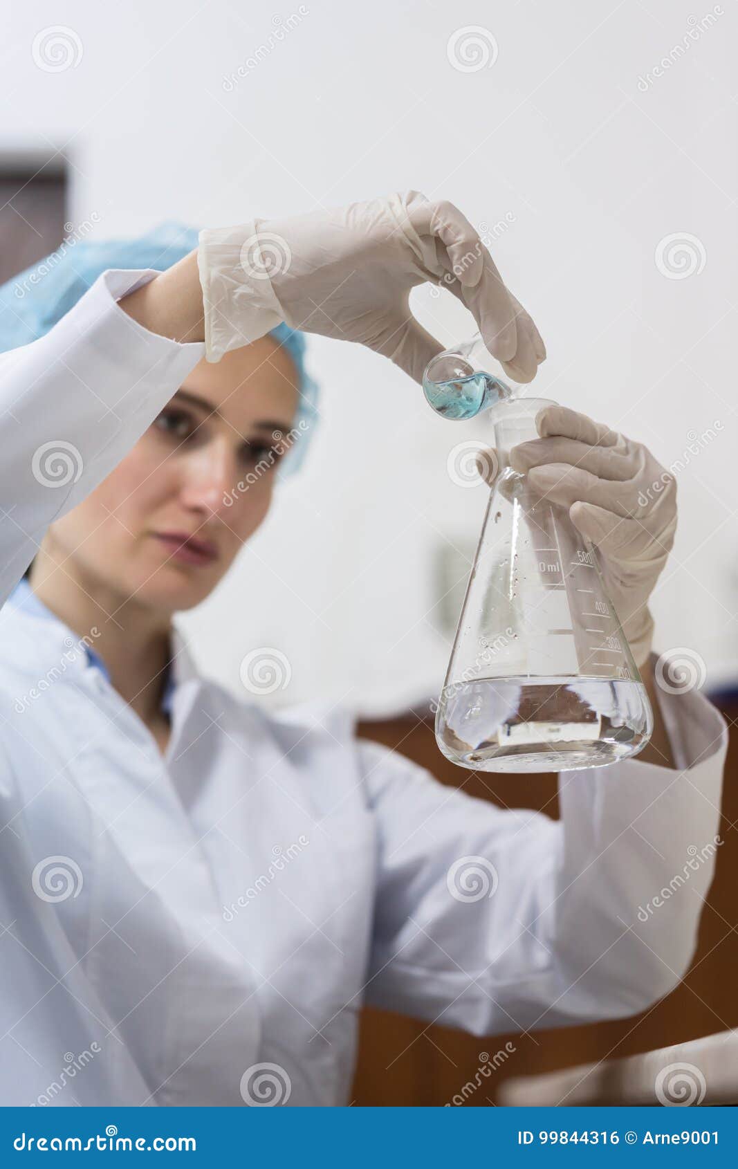 Chemist Mixing Two Liquid Chemical Substances during Experiment Stock ...