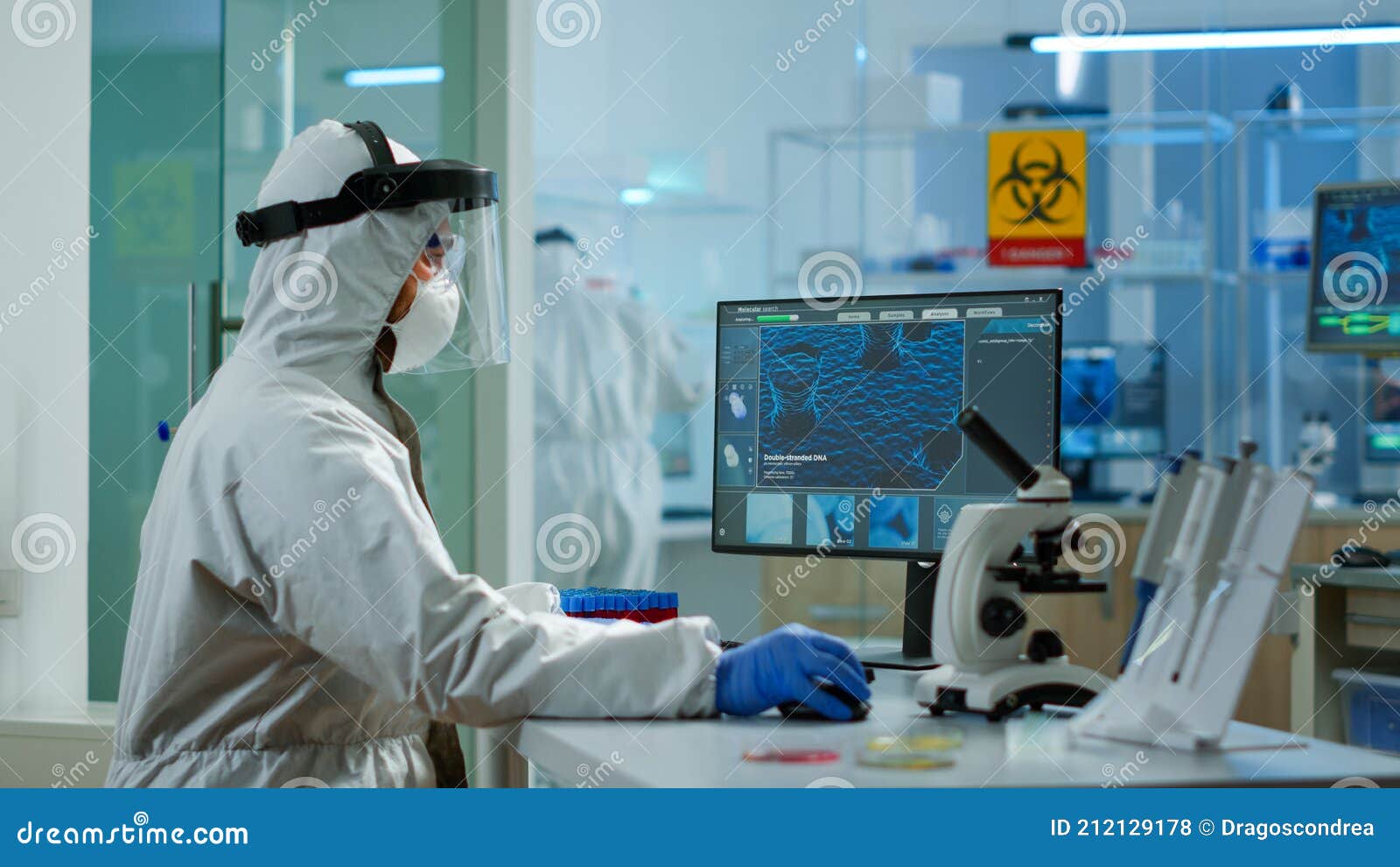 Chemist in Ppe Suit Typing on Computer Checking Vaccine Development ...