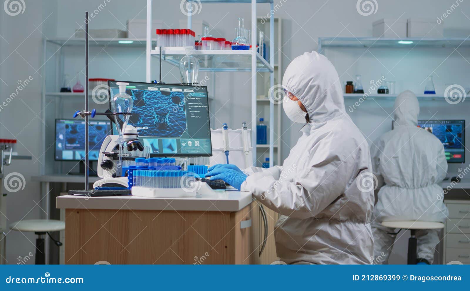 Chemist in Ppe Suit Typing on Computer Checking Virus Development Stock ...
