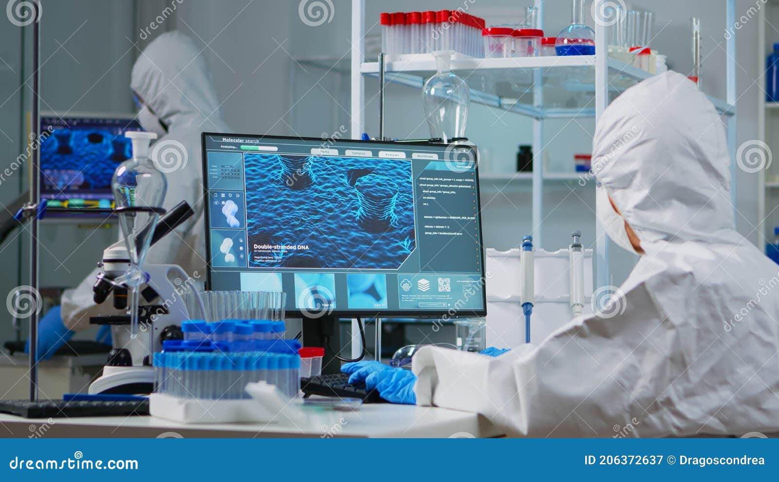 Chemist in Ppe Suit Typing on Computer Checking Virus Development Stock ...