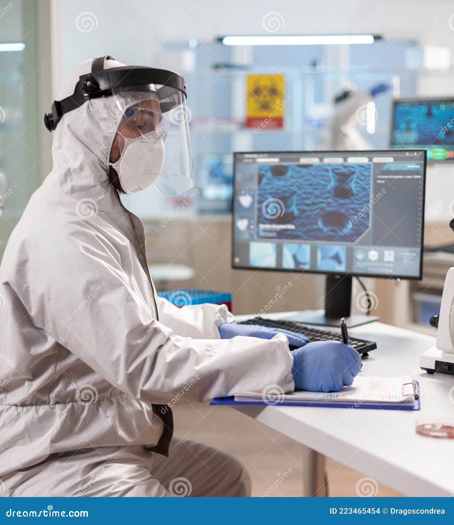 Chemist In Ppe Suit Typing On Computer Checking Virus Development Stock ...