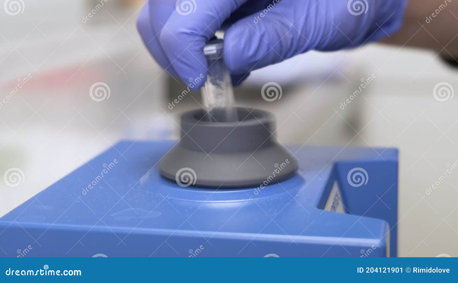 Chemist in Rubber Gloves Shaking Samples Using Vortex. Developing of ...