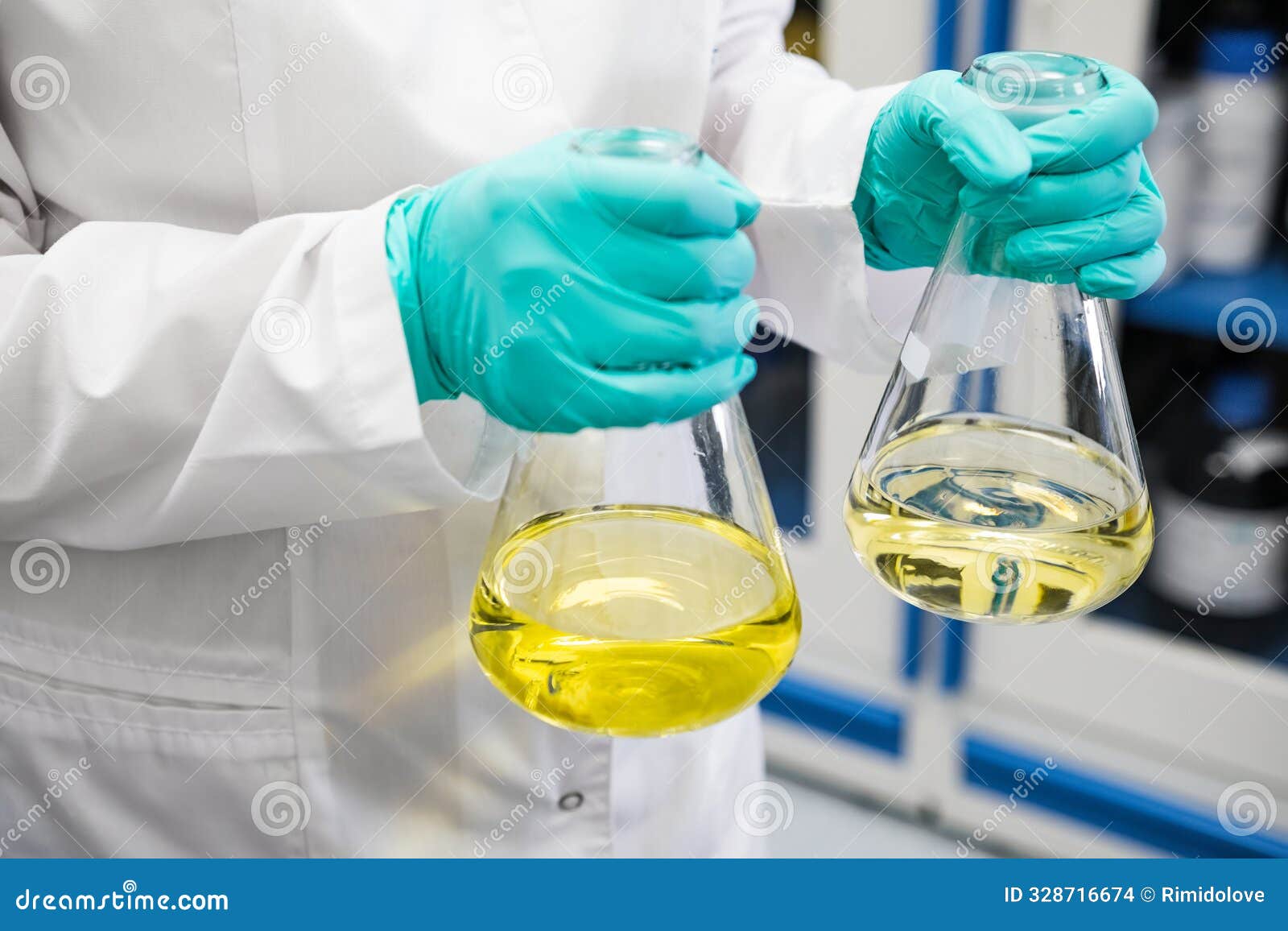 Chemist Shaking Yellow Samples of Urine before Conducting Biochemical ...