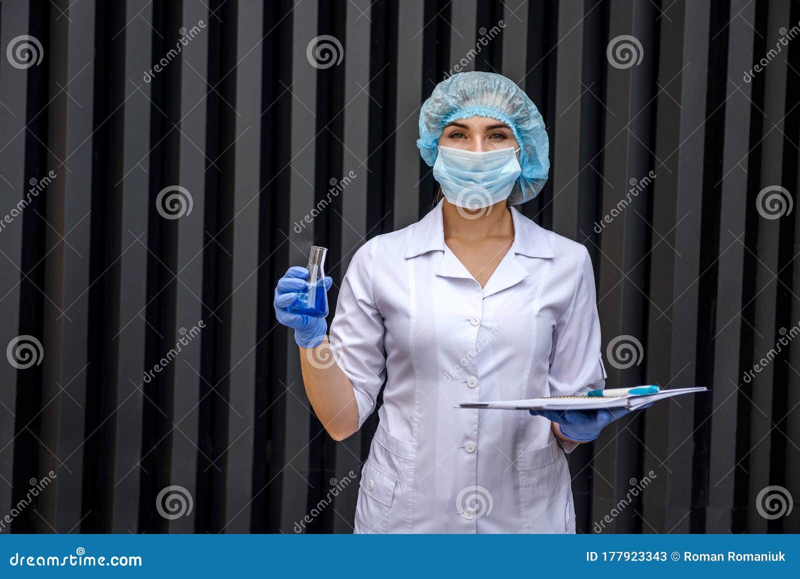 Chemist with Test Tubes Posing in Laboratory while Making Science ...