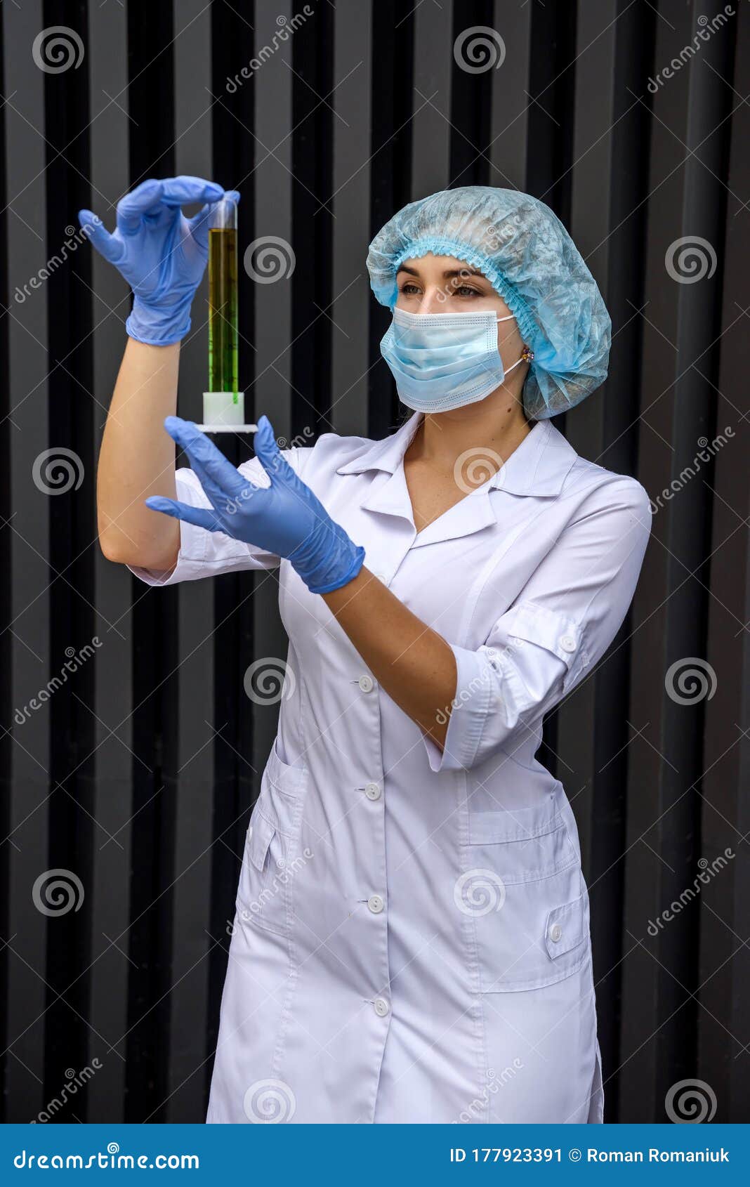 Chemist with Test Tubes Posing in Laboratory while Making Science ...