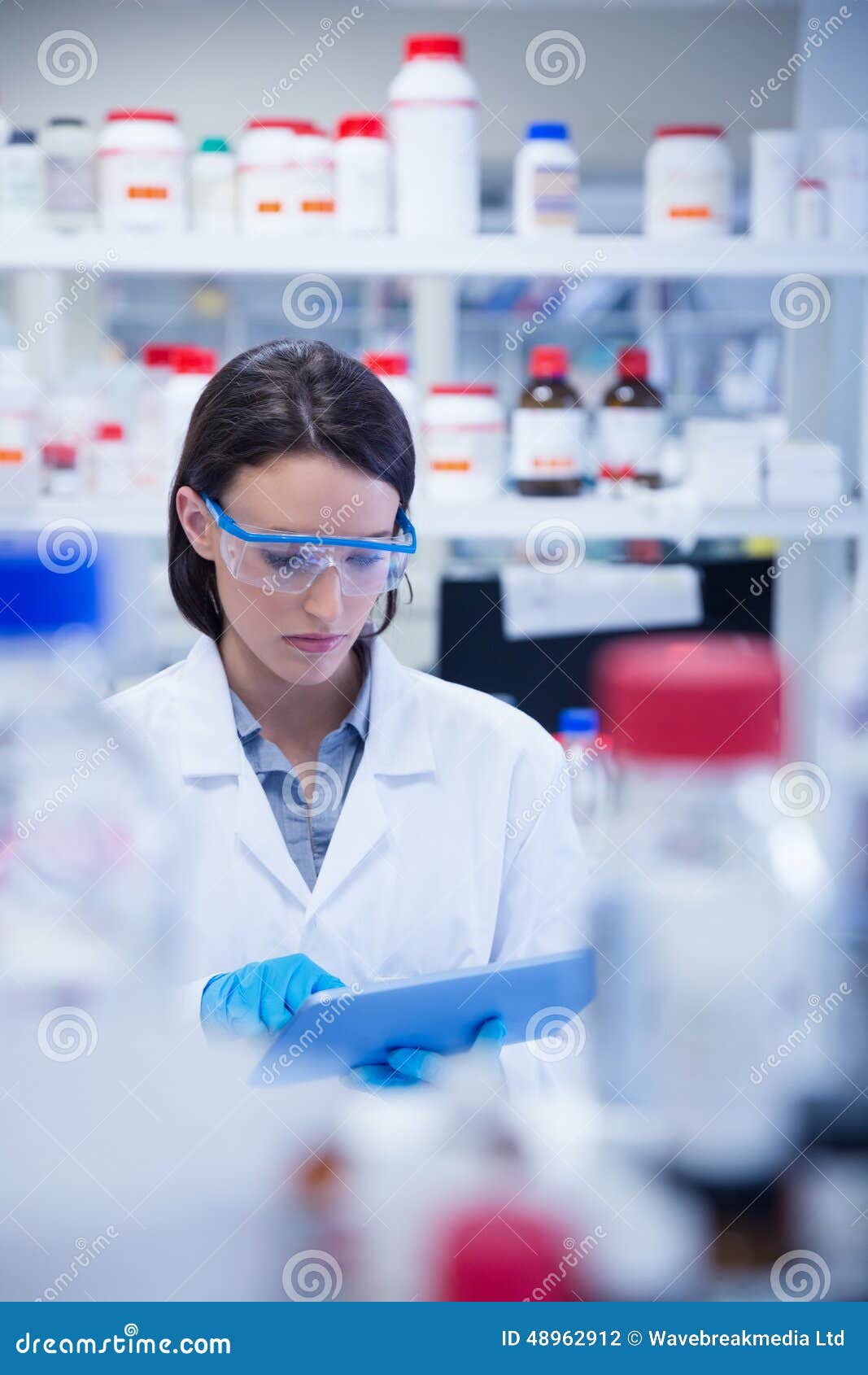 Chemist Wearing Safety Glasses and Using Tablet Pc Stock Photo - Image ...