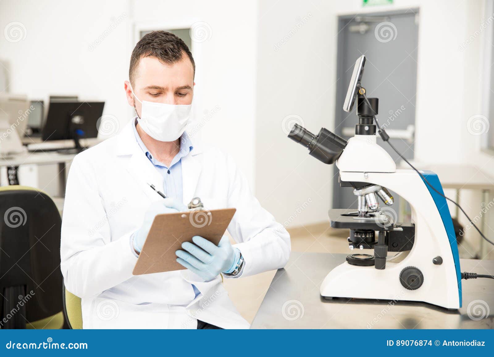 Chemist Working with a Microscope Stock Photo - Image of modern, busy ...