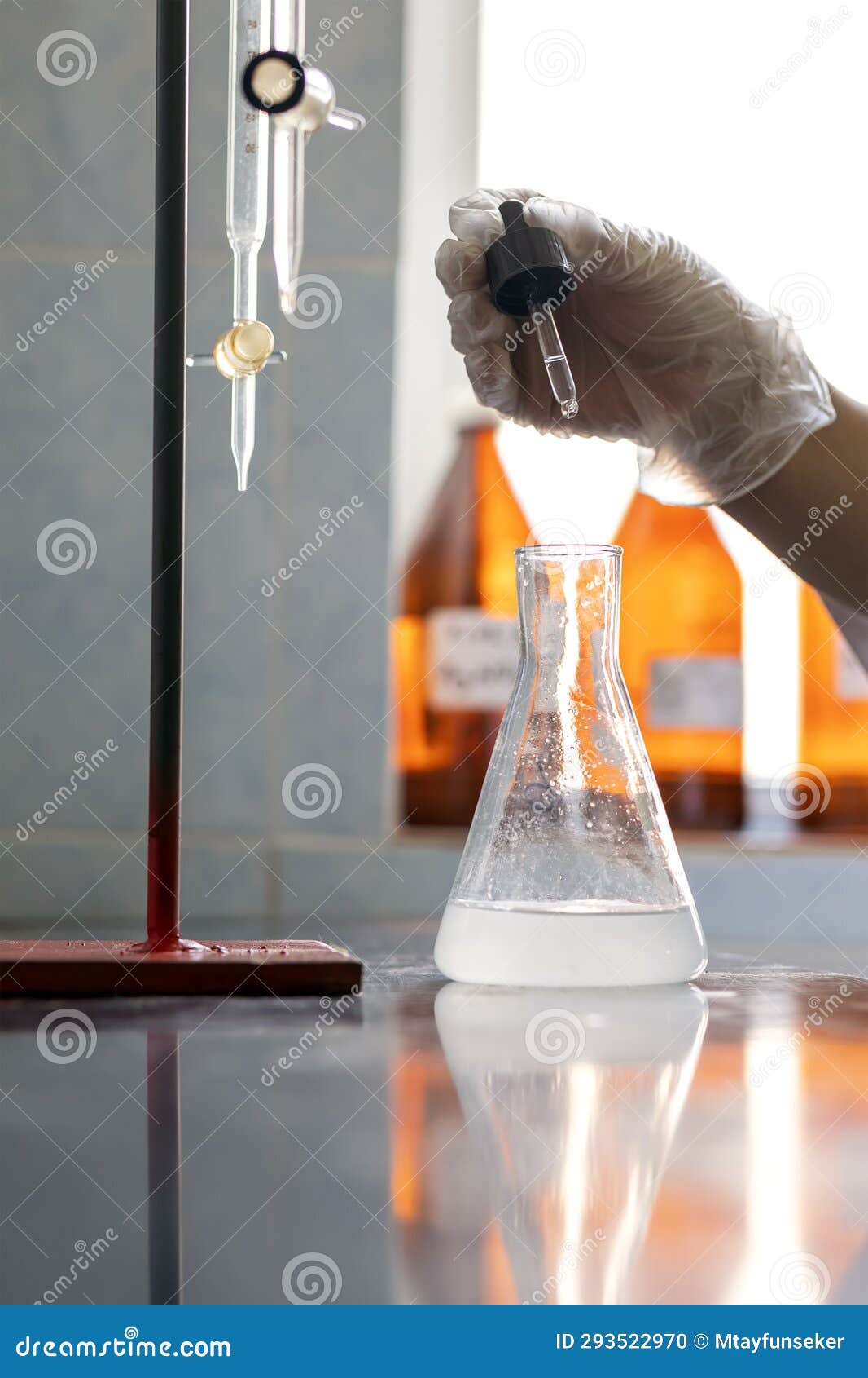 Chemistry Expert is Working with Solutions and Test Tubes on the ...