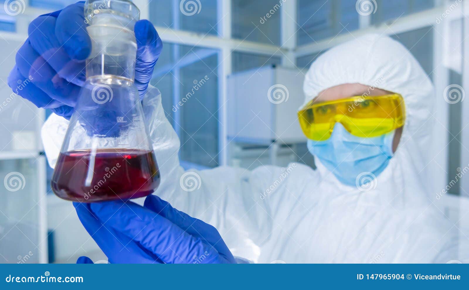 Chemistry Lab - Researcher Analyzing a Liquid in Laboratory Flask Stock ...