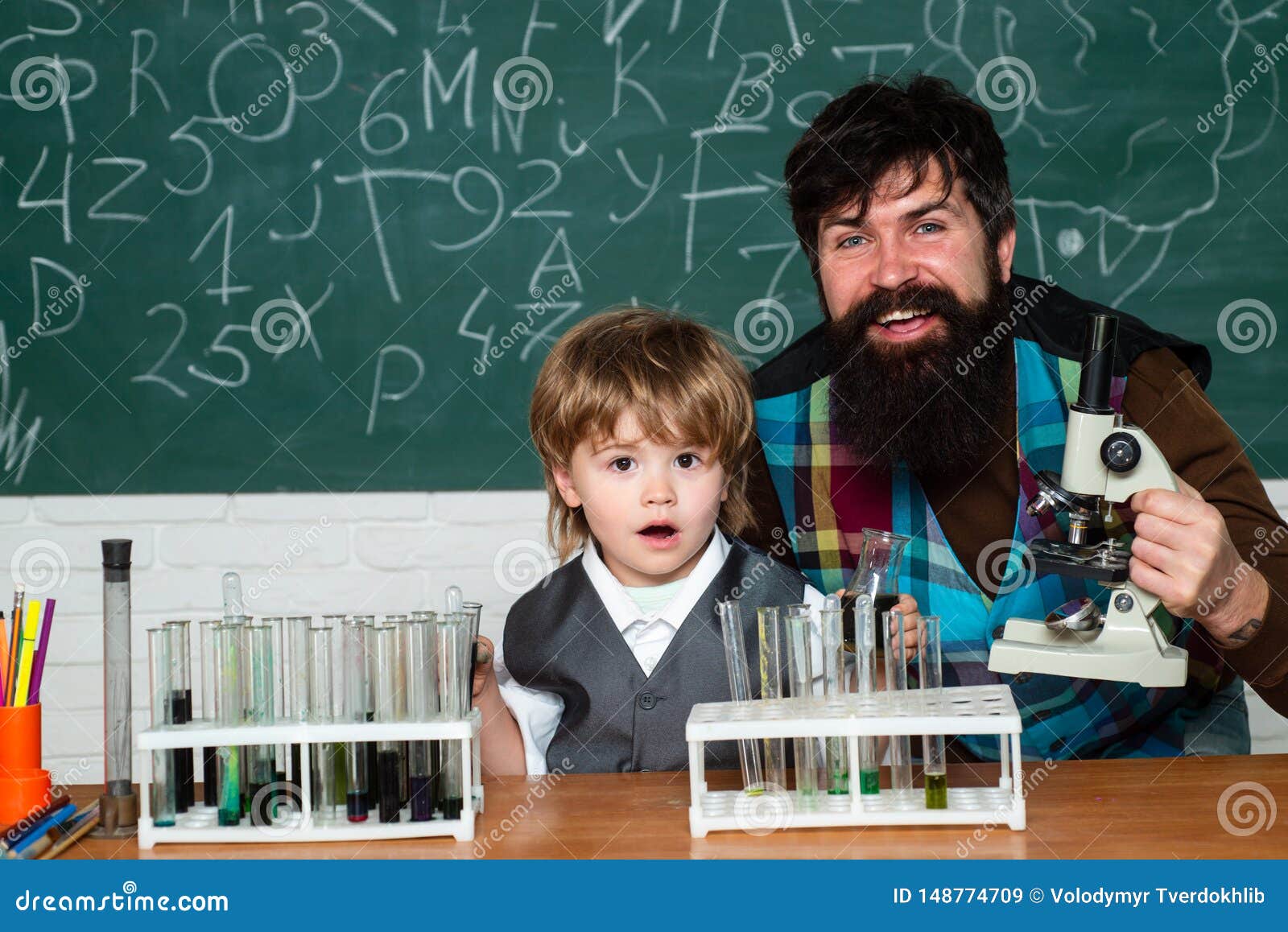 Chemistry The Science Classroom. School Child. Dad Son Are Concentrated ...