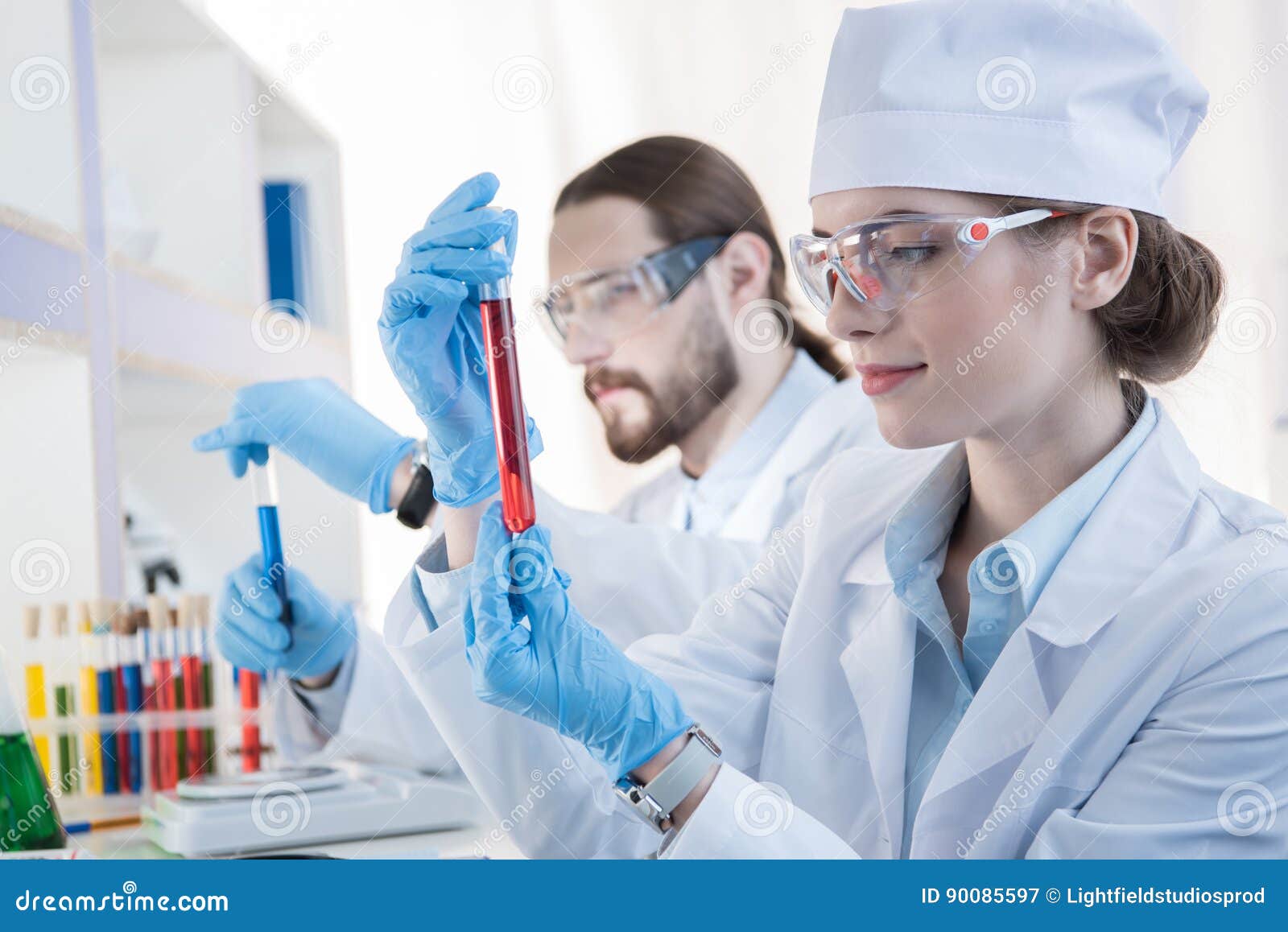 Chemists making experiment stock image. Image of reagents - 90085597