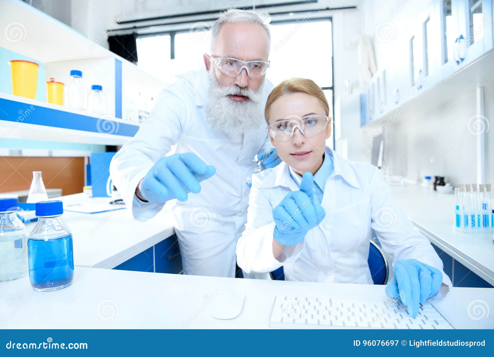 Chemists in Uniform Working in Lab with Computer Mouse and Keyboard ...