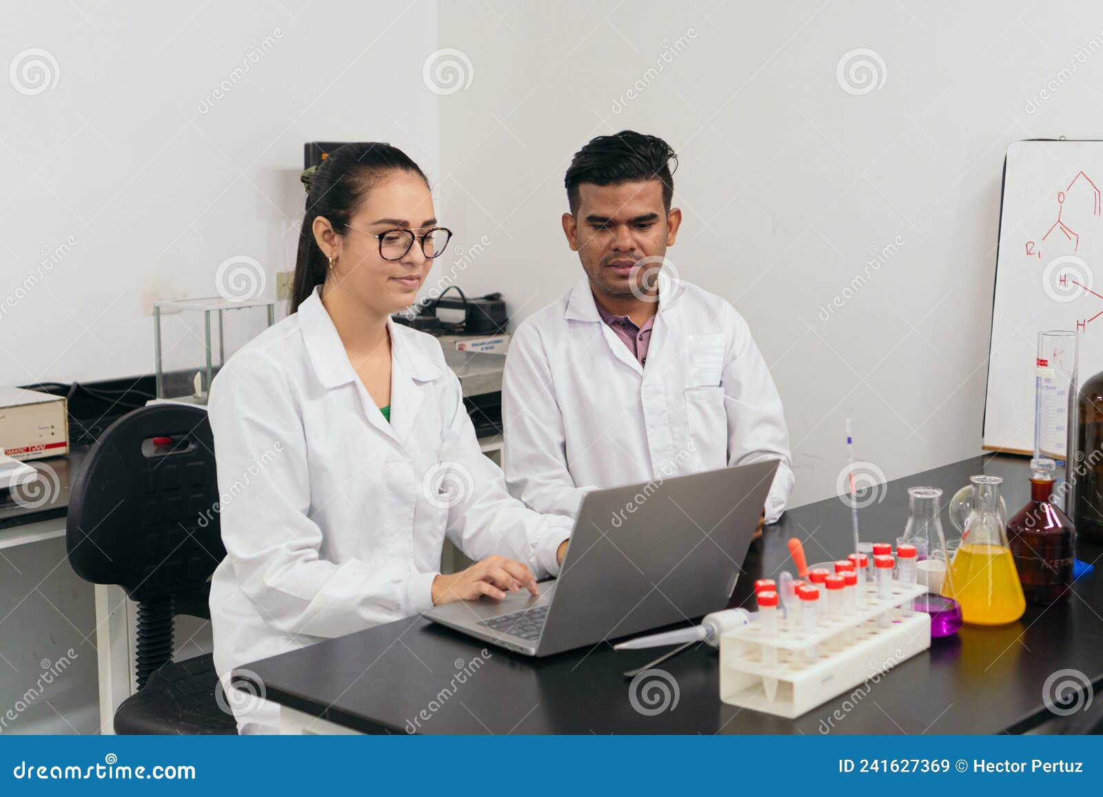 Chemists Using a Computer in a Chemistry Lab Stock Image - Image of ...