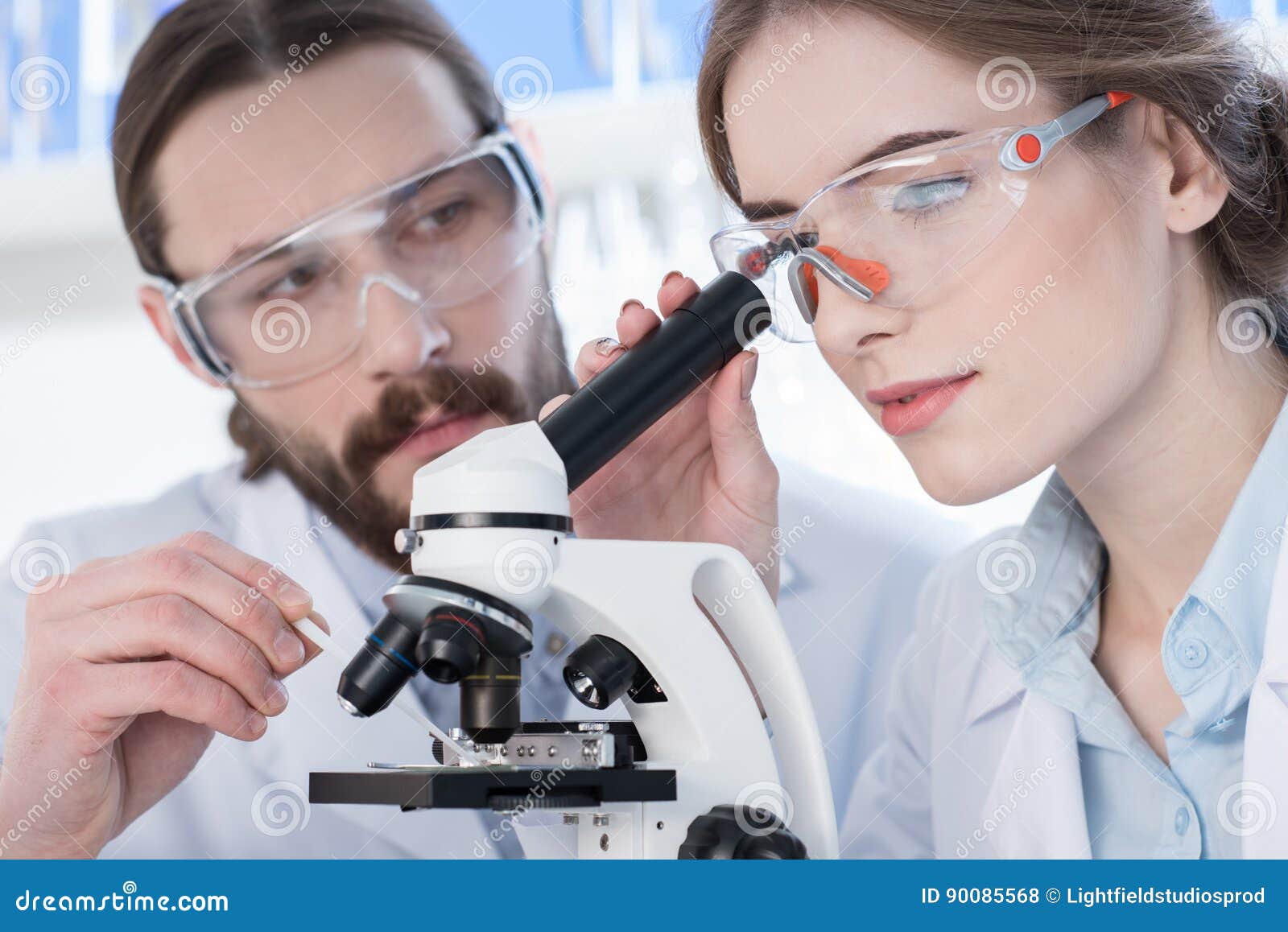 Chemists Working with Microscope Stock Photo - Image of research ...