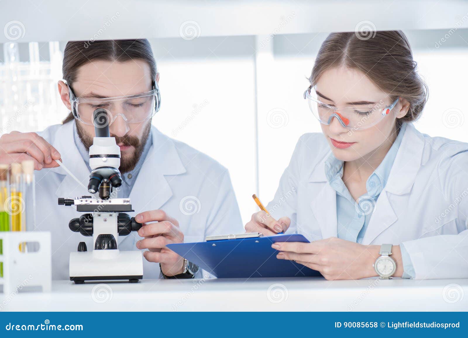 Chemists Working with Microscope Stock Photo - Image of invention ...