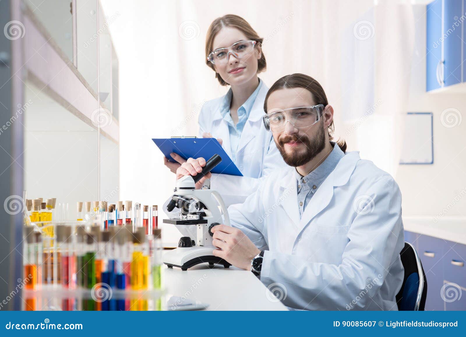 Chemists Working with Microscope Stock Image - Image of chemical ...