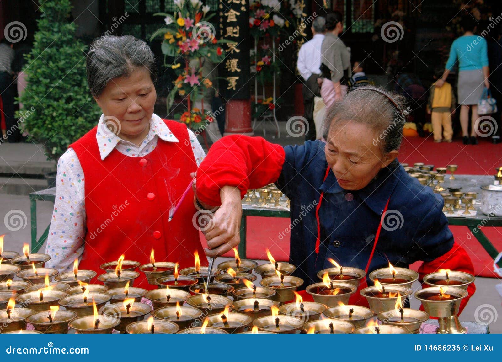 Chengdu, China: Woman Lighting Flame Editorial Photo - Image of stick ...