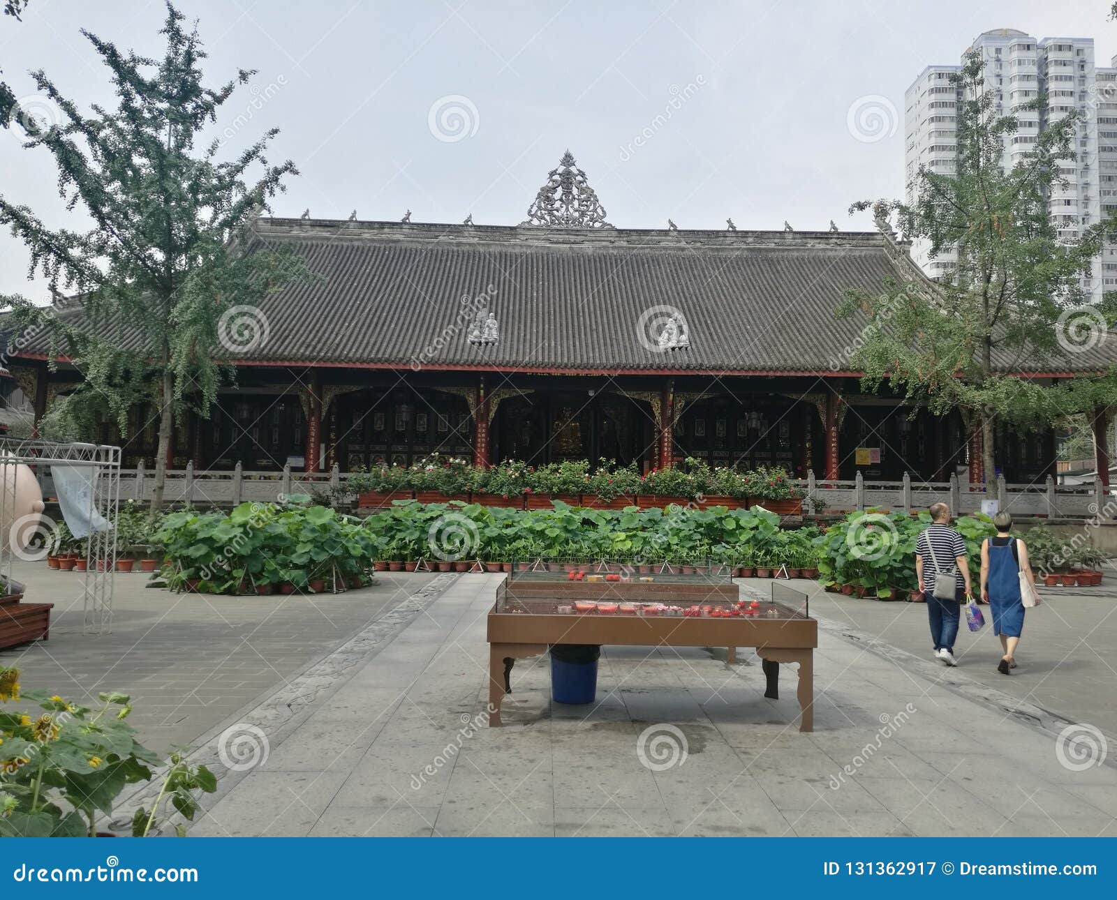 Xindu, China: Girl At Bao Guang Temple Editorial Image | CartoonDealer ...
