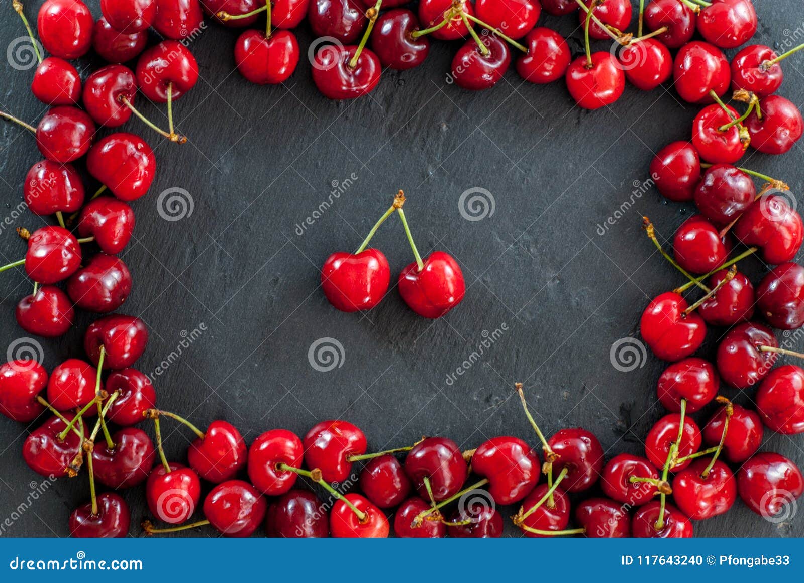 Cherries Arranges As a Frame on Black with Cherries in the Middle ...