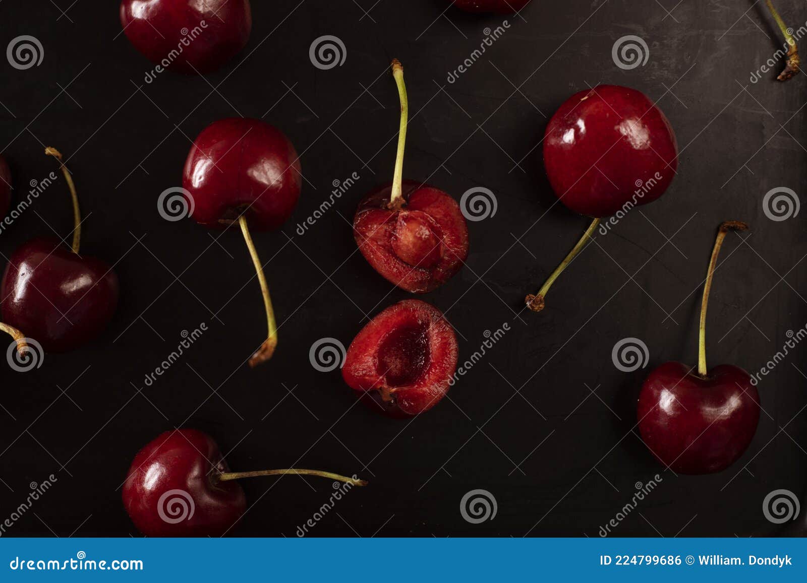Cherries and a Half Cherry with Seed on a Dark Background Stock Photo ...