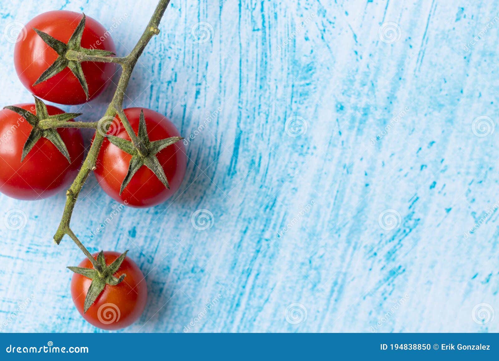 Cherry Tomatoes on Blue Brushstroke Background Stock Photo - Image of ...