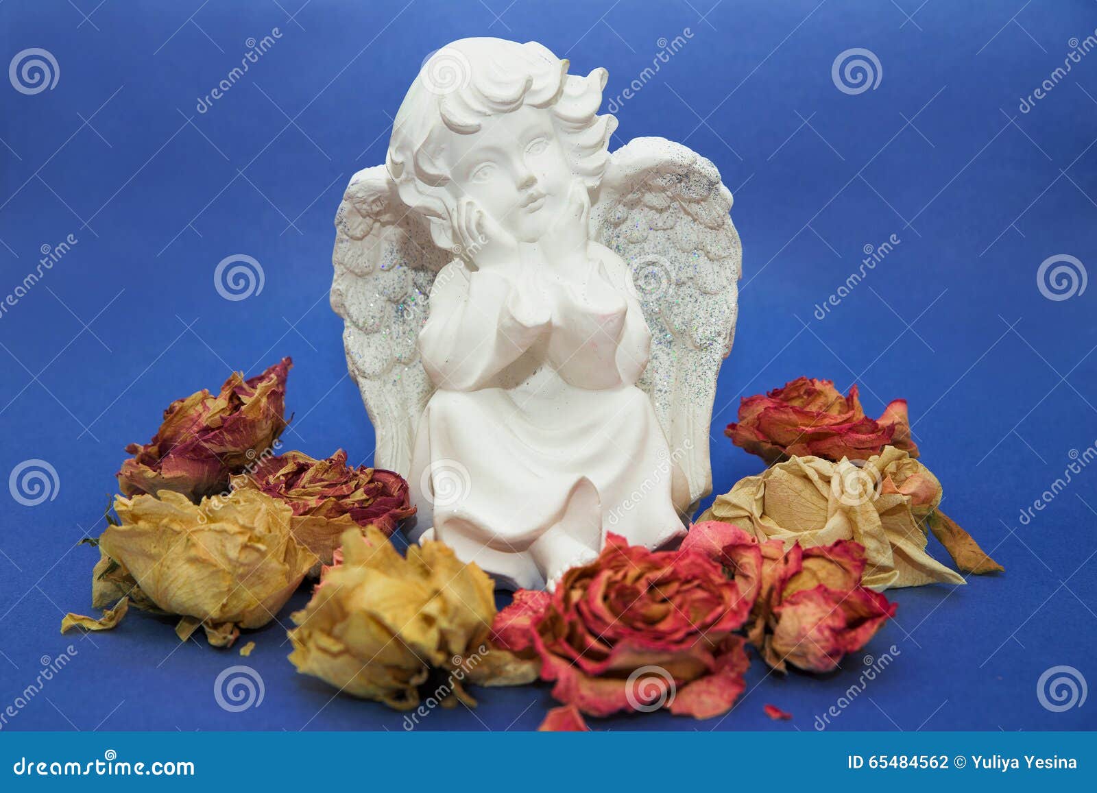 Cherub statuette on blue stock photo. Image of ornament - 65484562