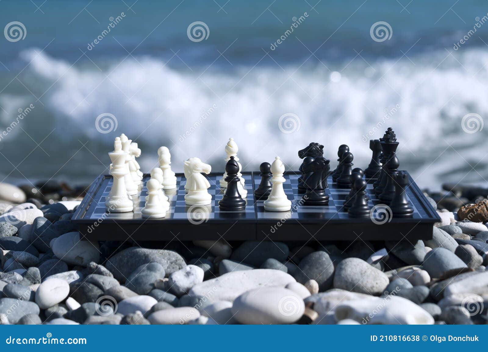Chess board on the beach stock photo. Image of playing - 210816638