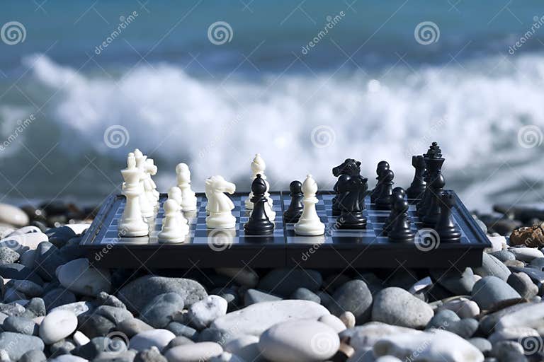 Chess board on the beach stock photo. Image of playing - 210816638