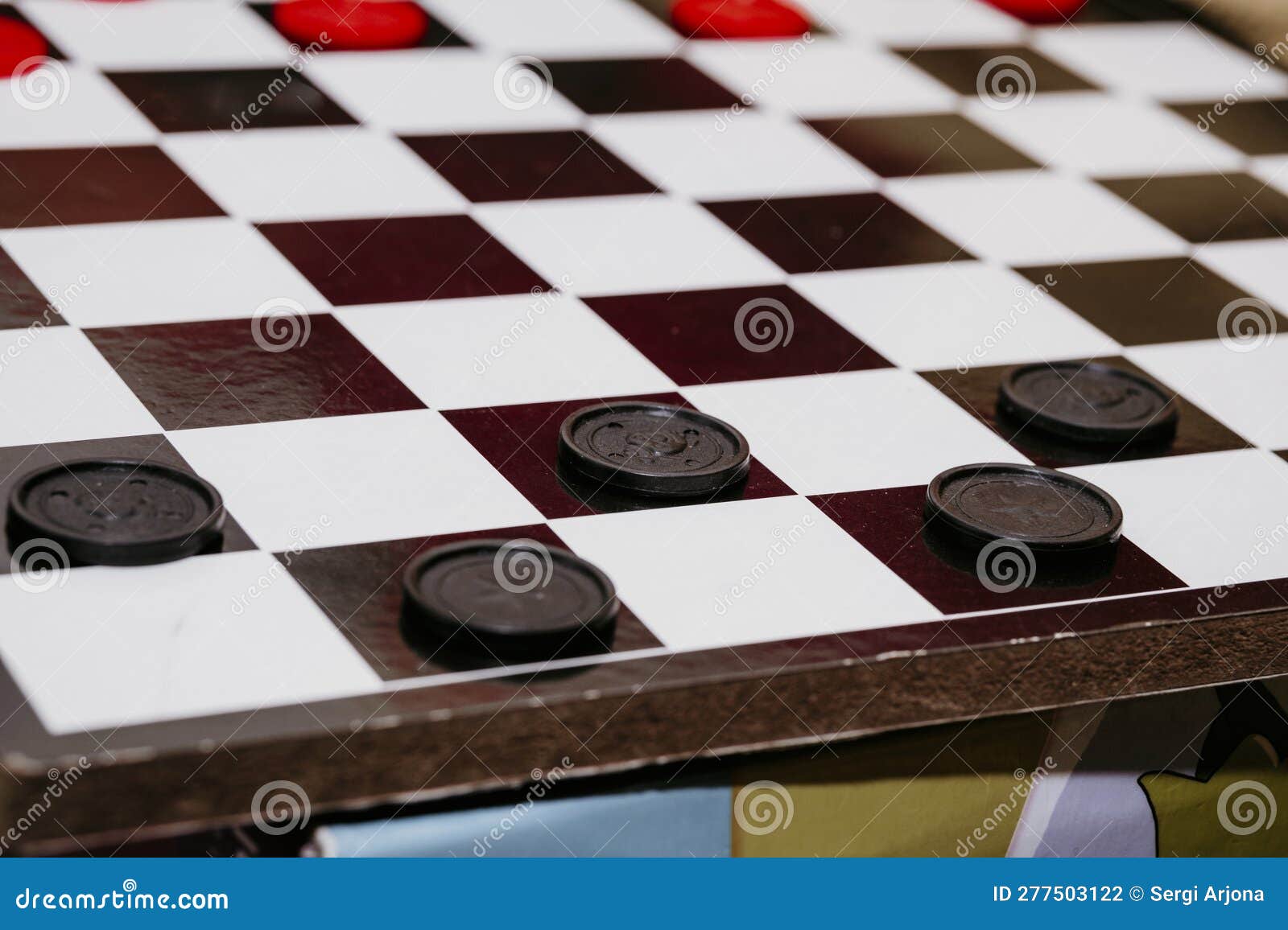 Chess Board with Checkers Pieces Placed on Top Stock Photo - Image of ...