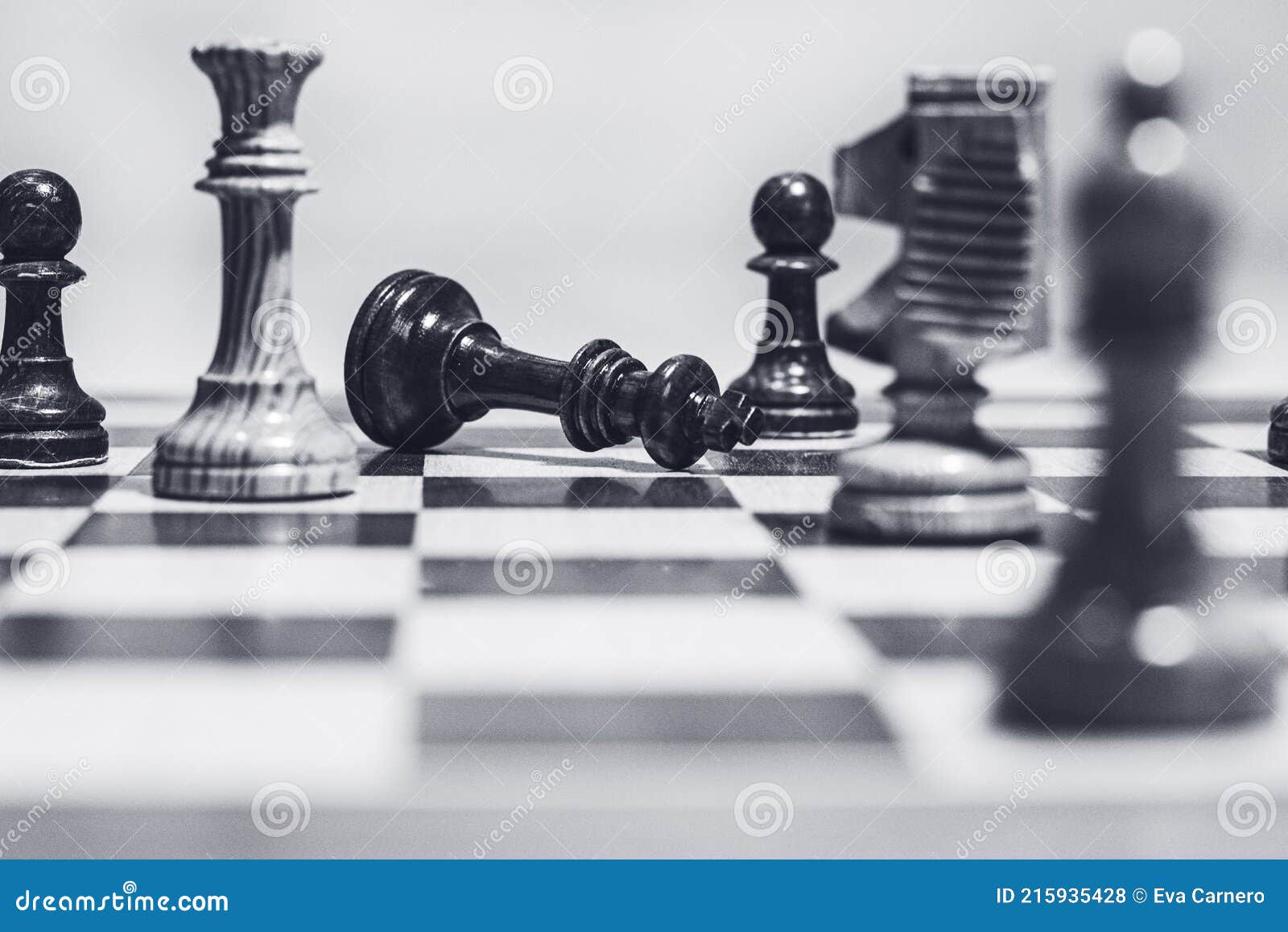 Chess Board with the Chips and the King Lying in Checkmate Stock Photo ...