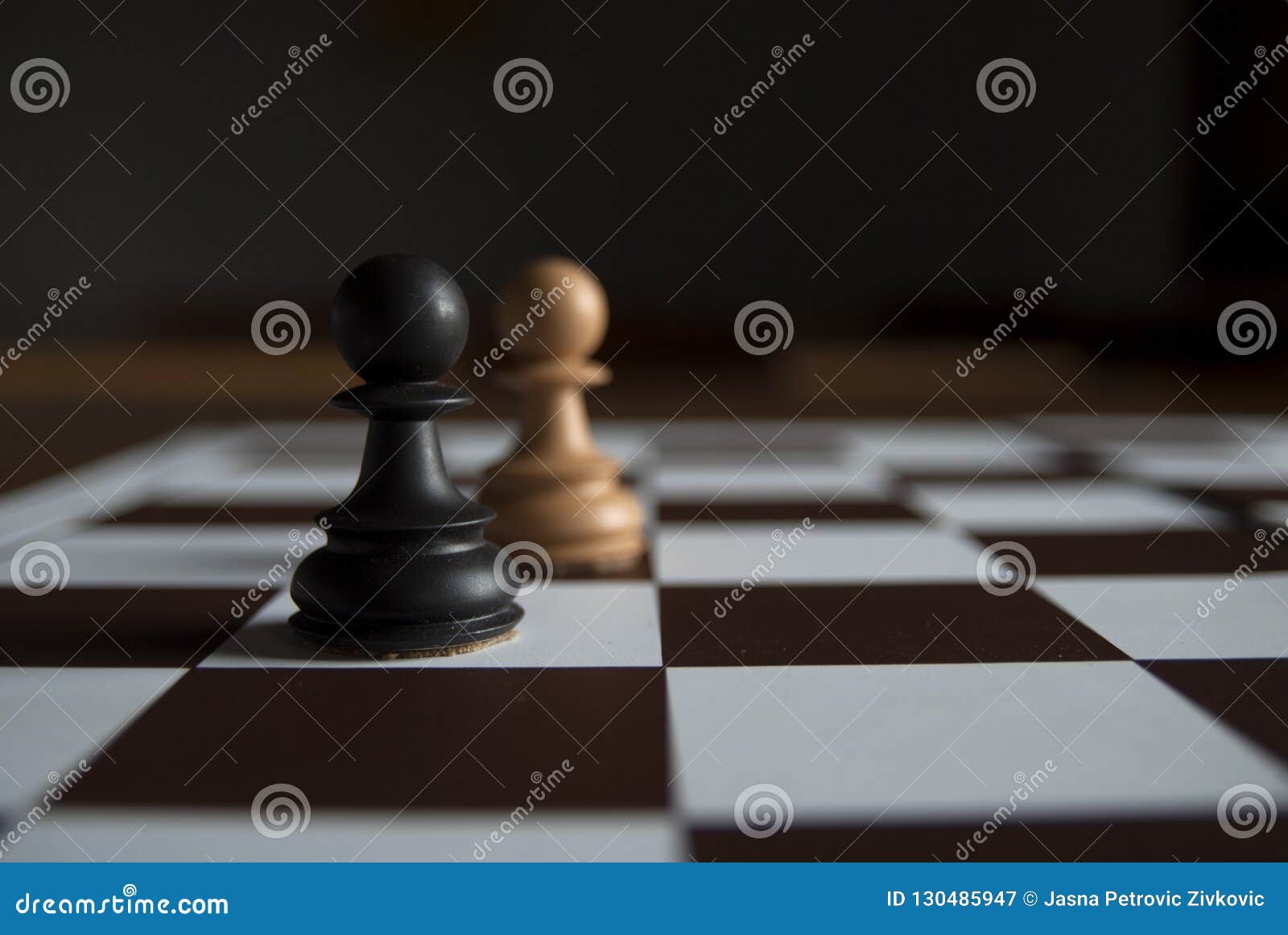 Chess Board with a Few Chess Pieces and Chess Watch in Back Stock Image ...