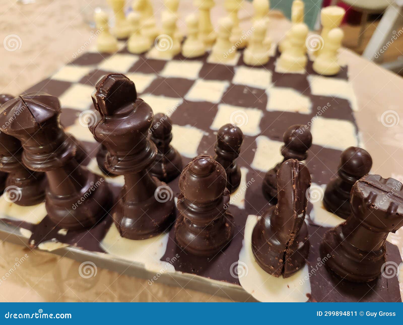 Chess Board with Pieces of Chocolate and Pieces of White and Dark ...