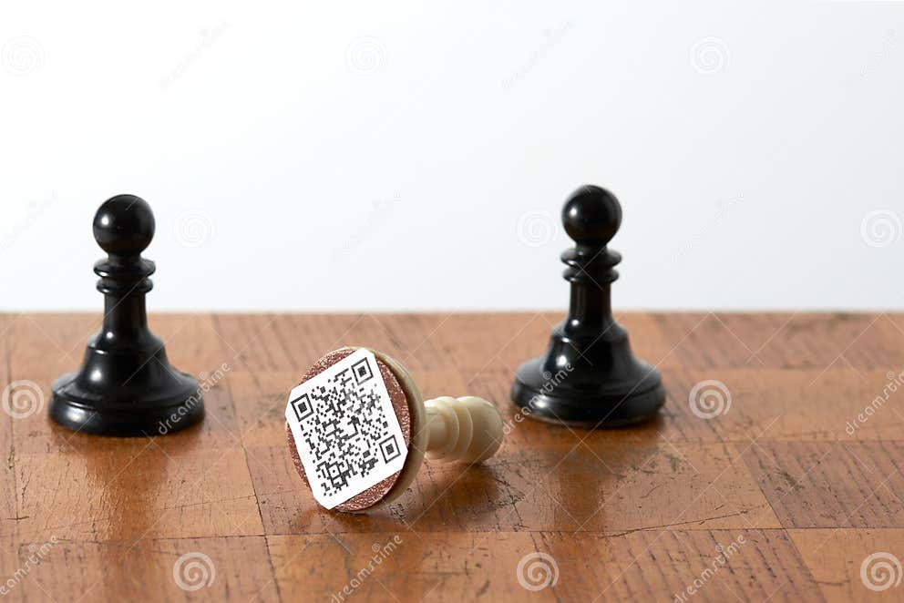 A Chess Board with Several Chess Pieces, One of Which Has a QR Code ...