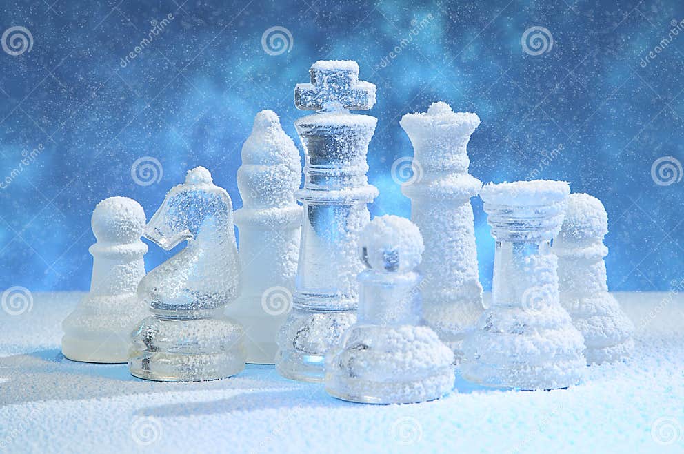 Chess figures under snow stock photo. Image of chance - 17694874
