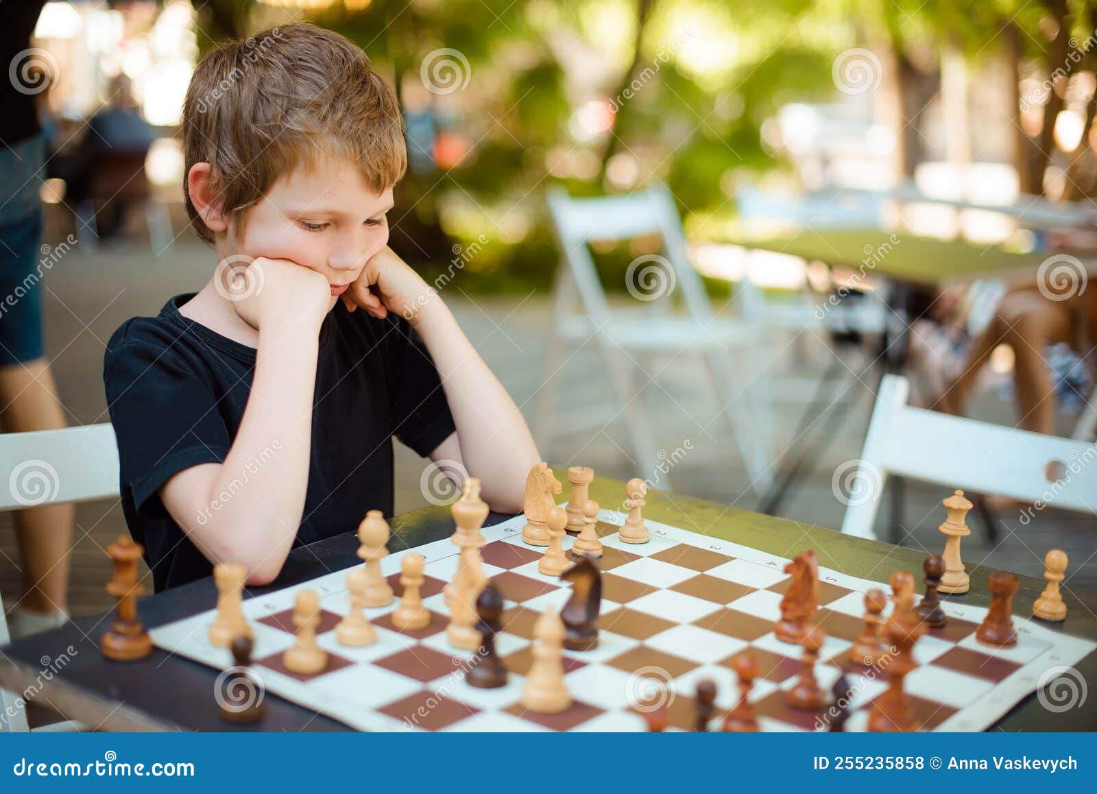 Thinking Boy Plaing Chess in the Park in Summer Stock Photo - Image of ...