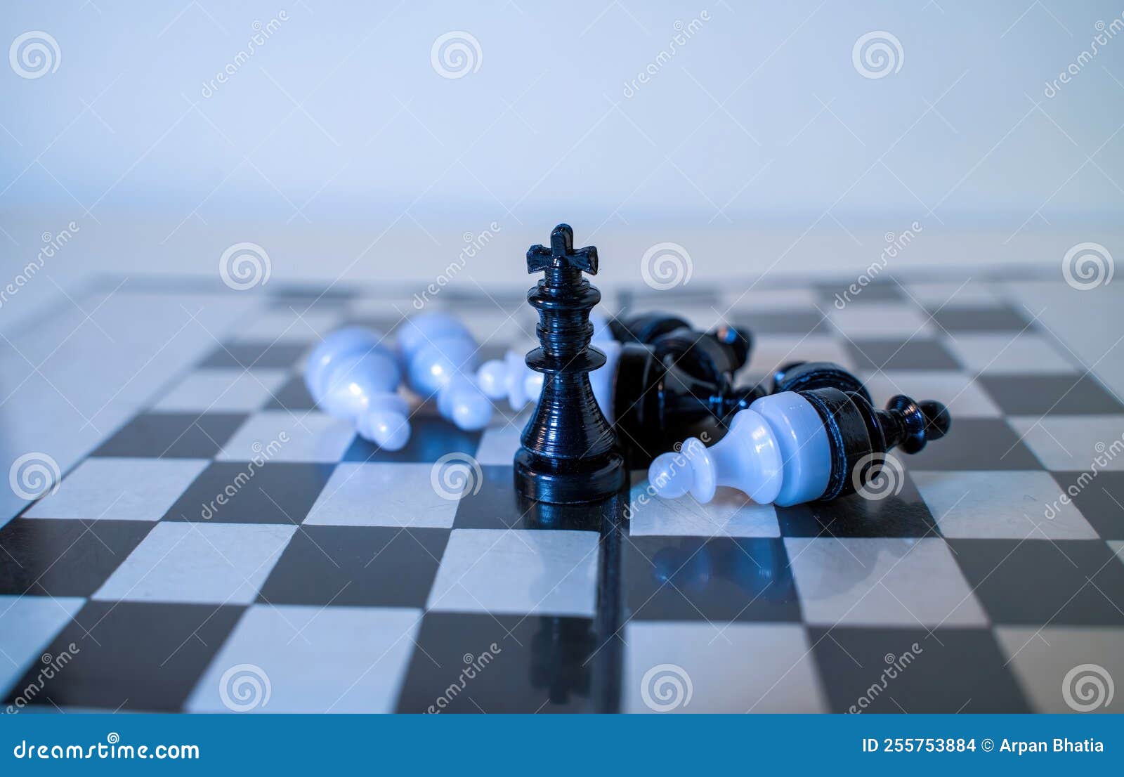 Chess King and the Fallen Figures on Chess Board Showing Power and ...
