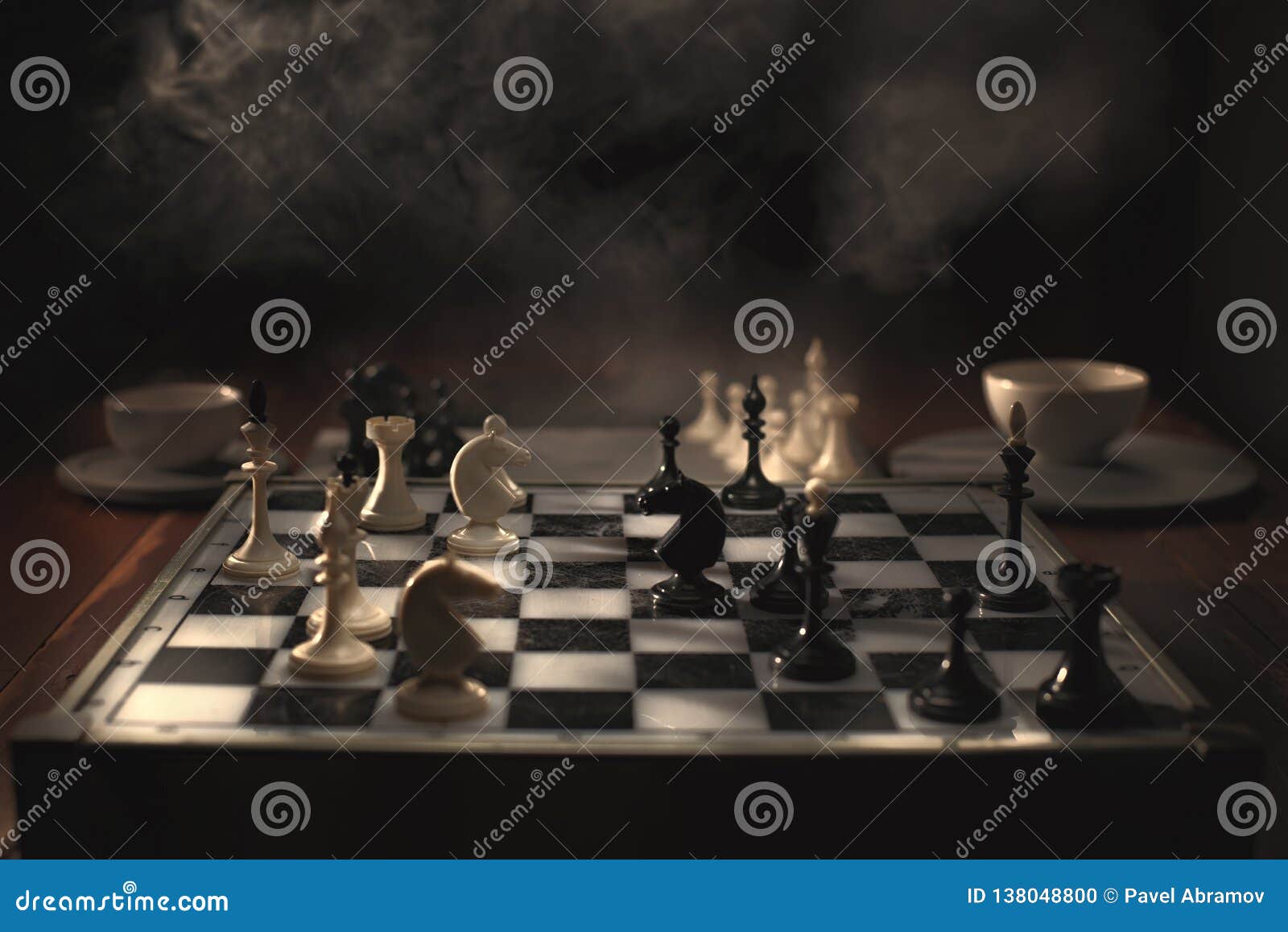 Chess Pieces on the Chessboard. Dark Background and Smoke Stock Photo ...